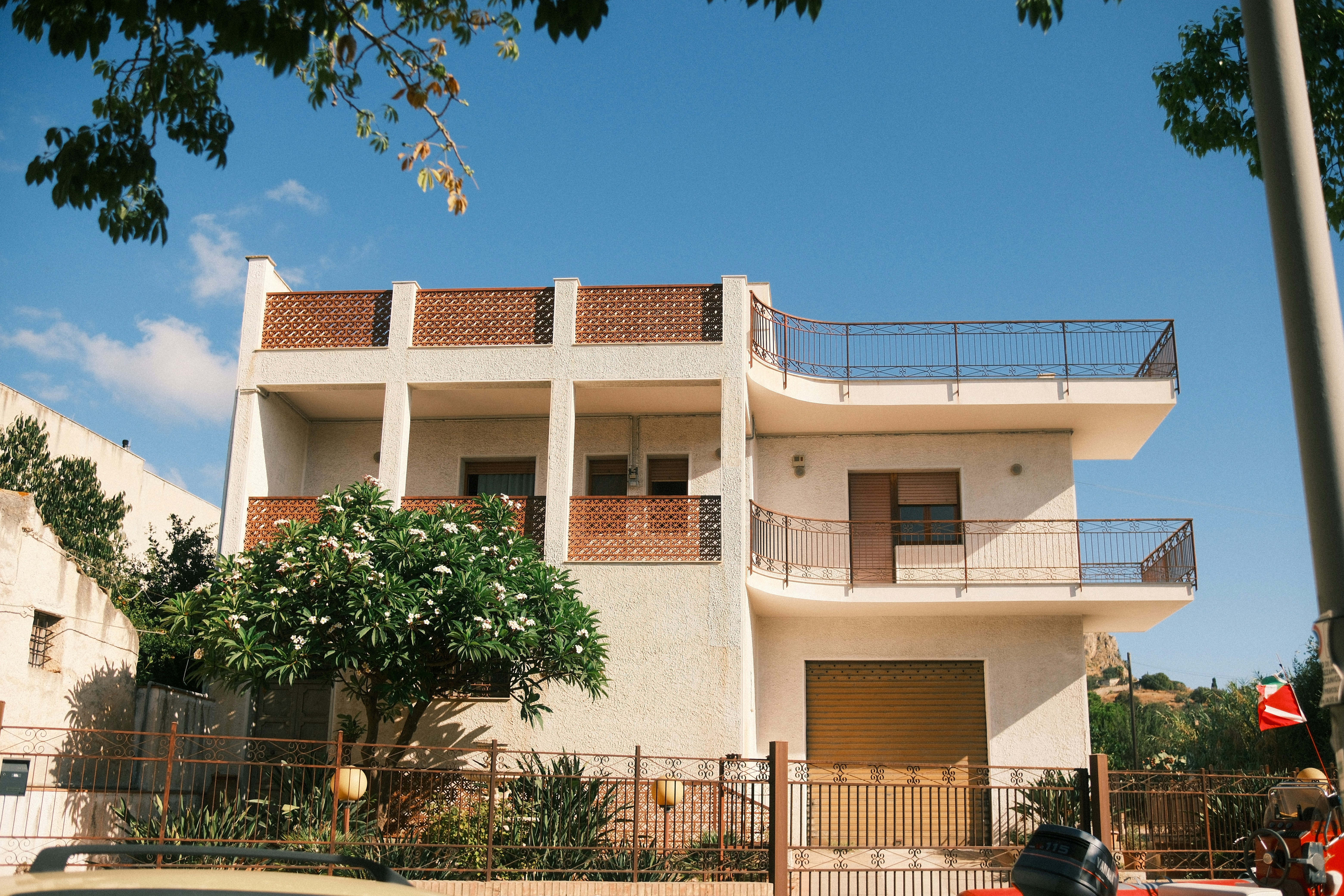 Midcentury Concrete Terrace Under a Bright Blue Sky