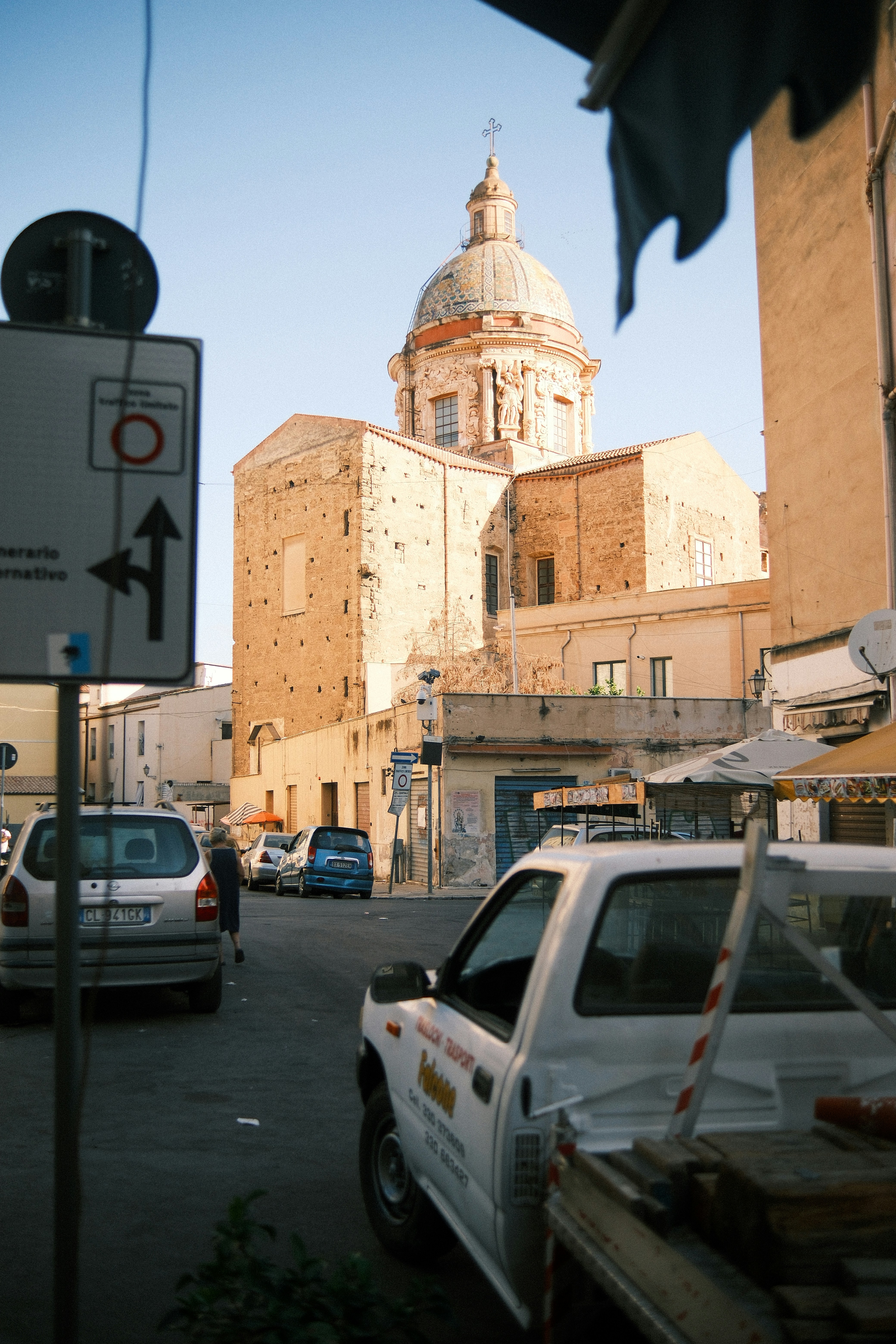 Clocked Dome Over a Sunlit Stone Street