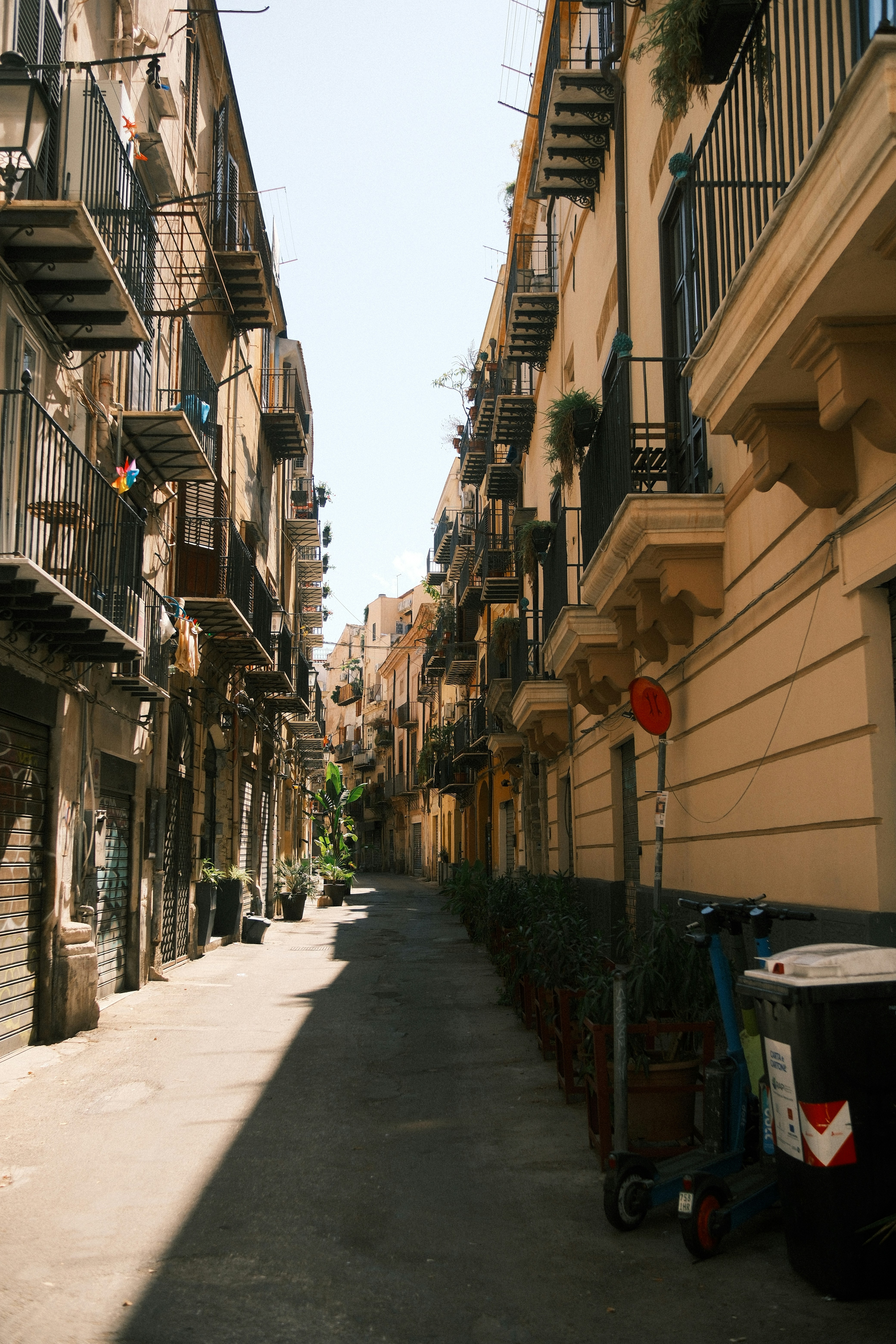 Sunlit Alleyways: A Quiet Corridor Between Historic Facades