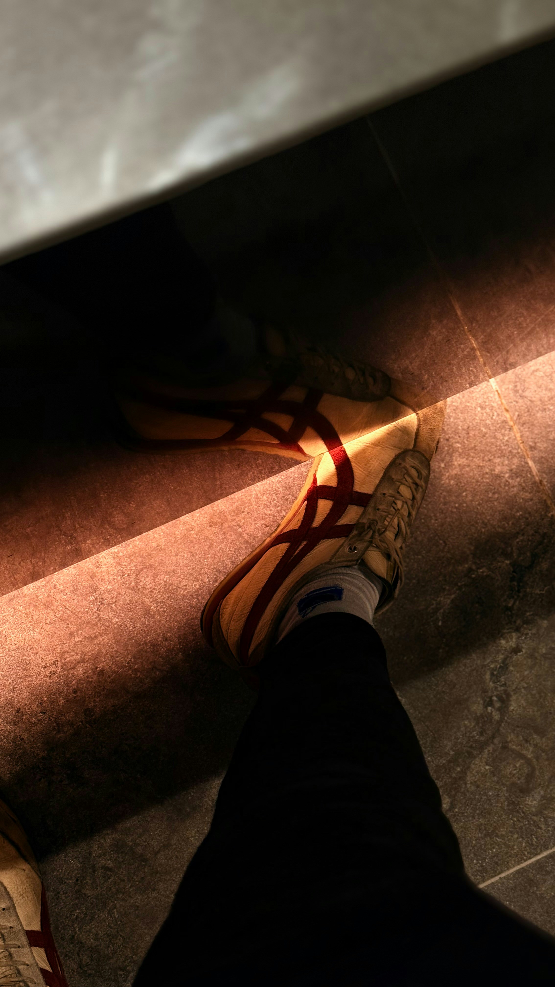 Walking the Line: Footsteps and Shadows on a Dim Staircase