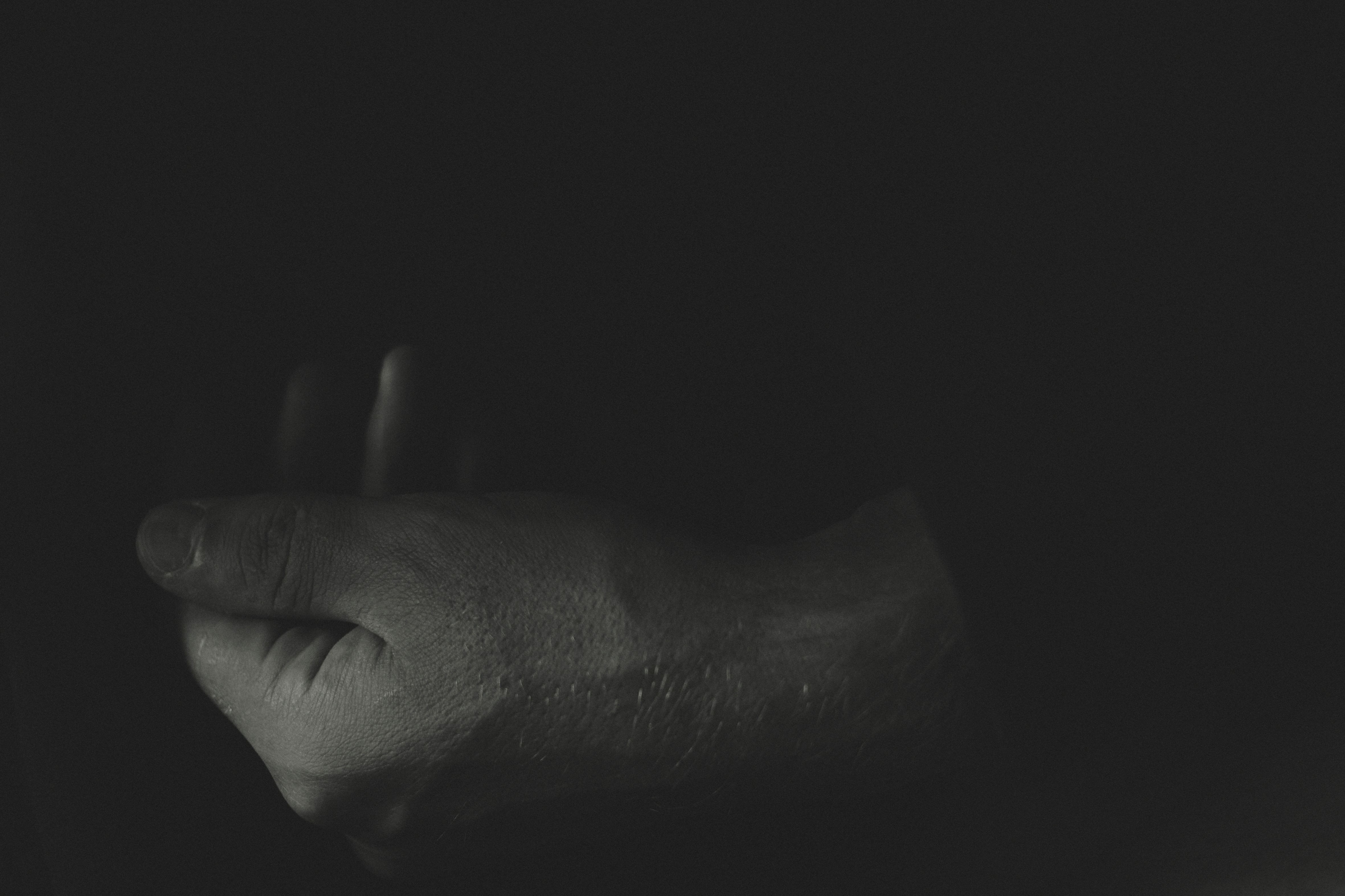Low‑Light Grasp: A Gripped Moment in Darkness