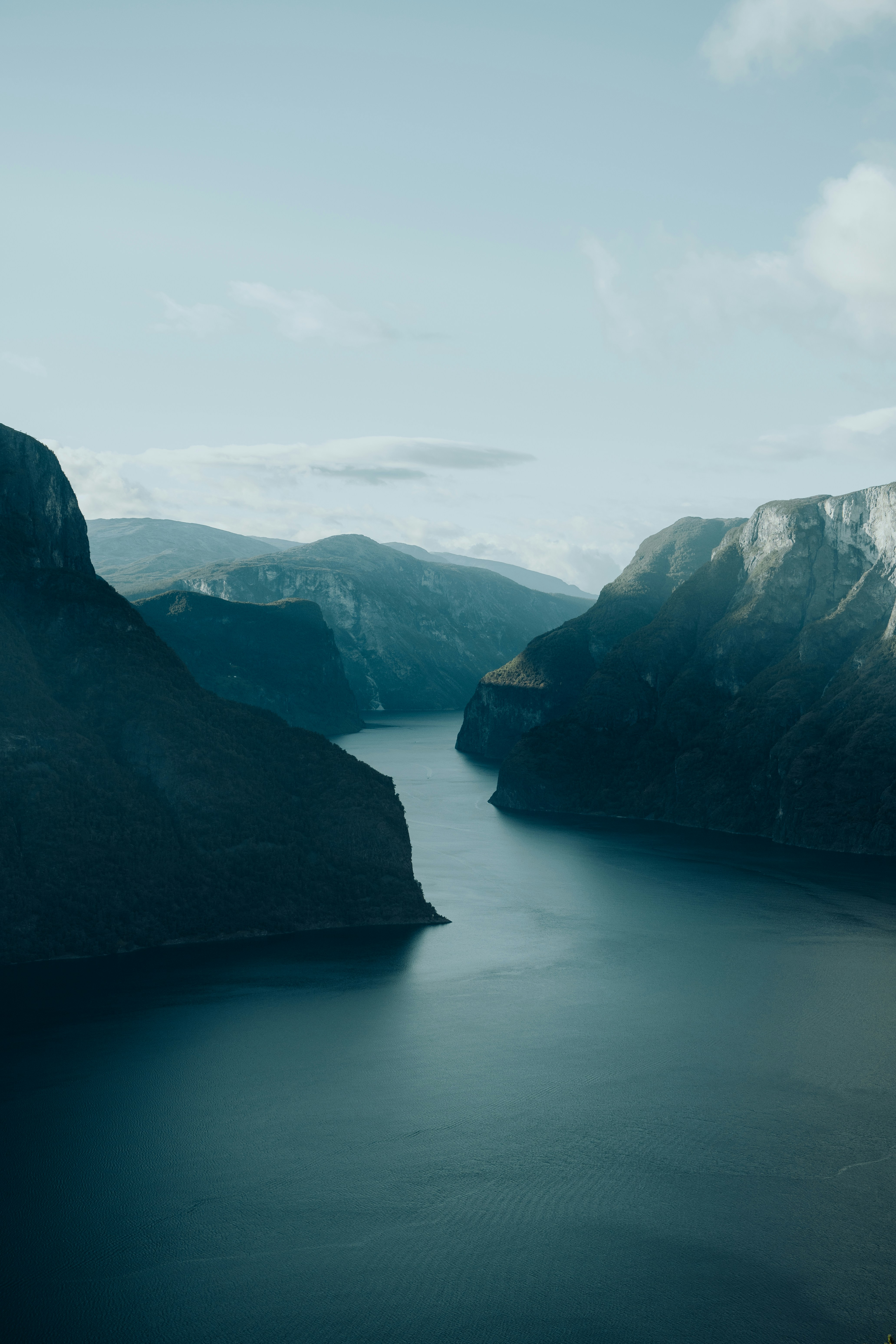 Silent Fjord Funnel: A Narrow Waterway Between Cliff Walls