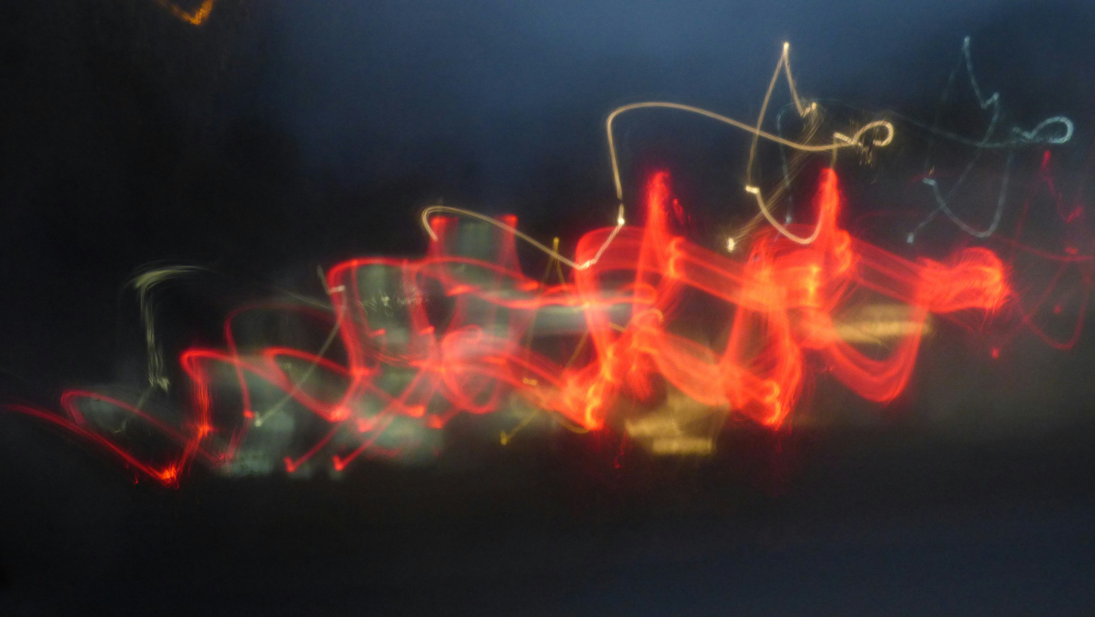 Neon Whispers: Long-Exposure Light Trails in Motion