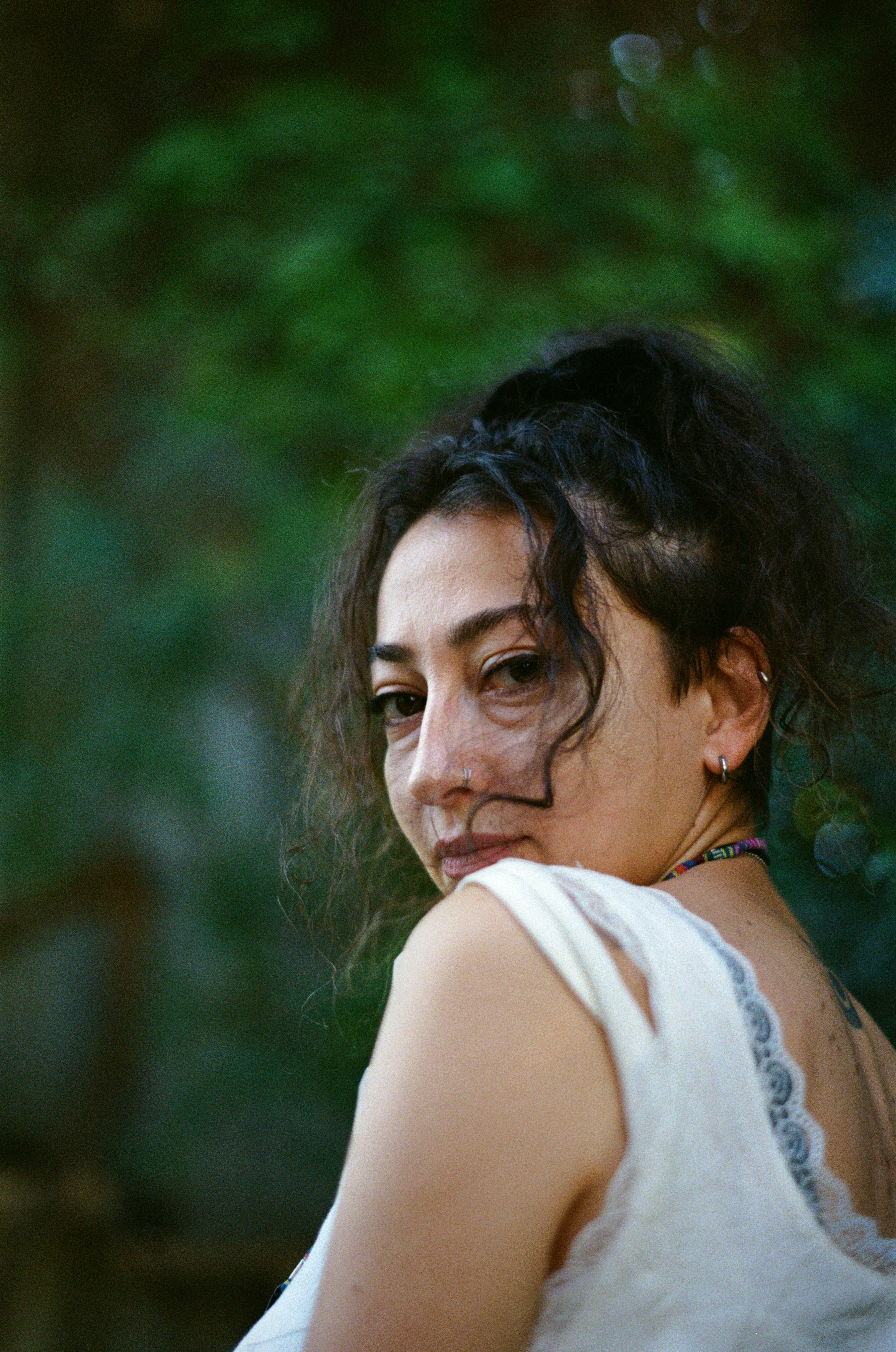 Portrait in a Gentle Breeze: A Woman’s Gaze in Soft Light