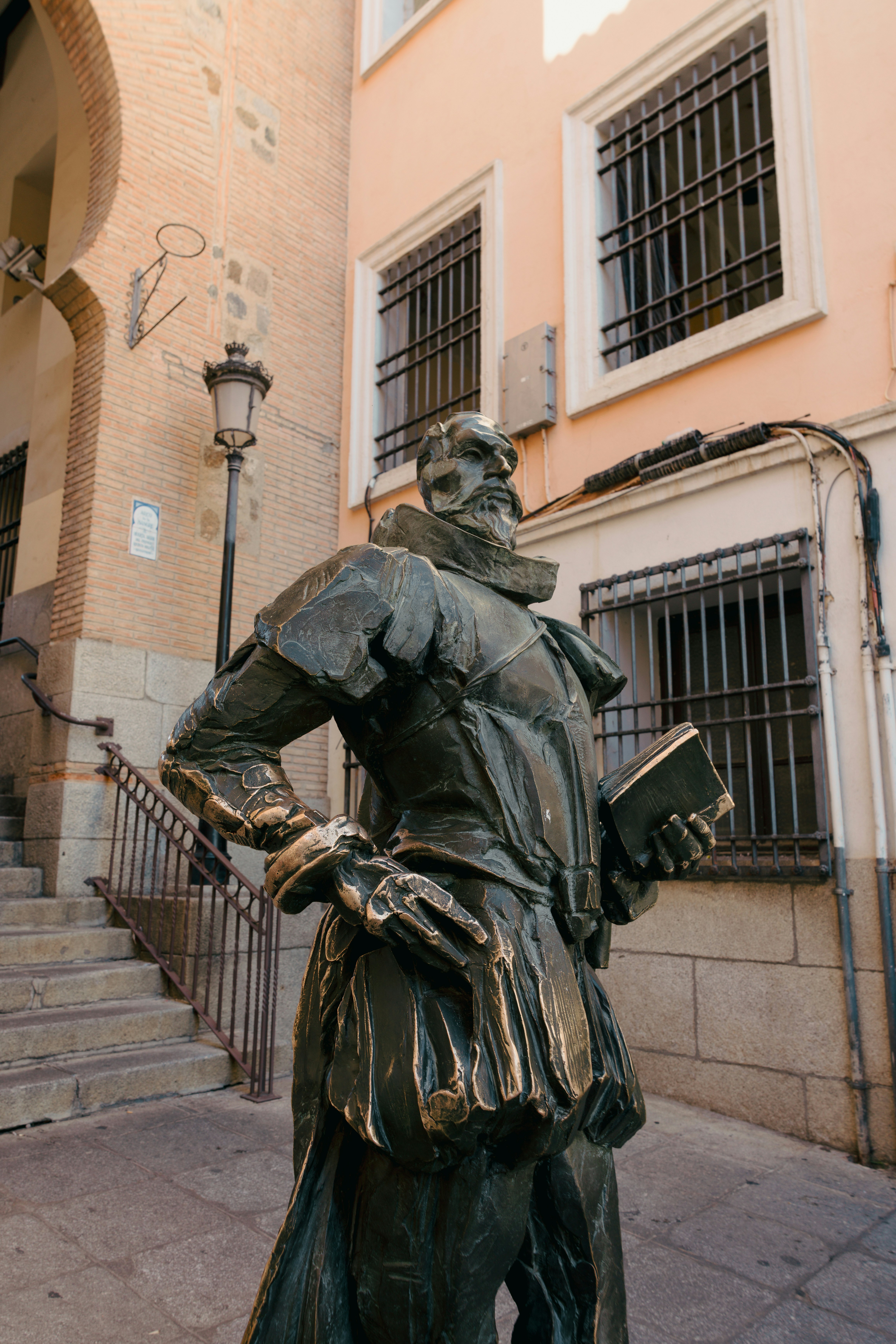 Bronzed Professor: A Stalwart Scholar Guards the Stairwell