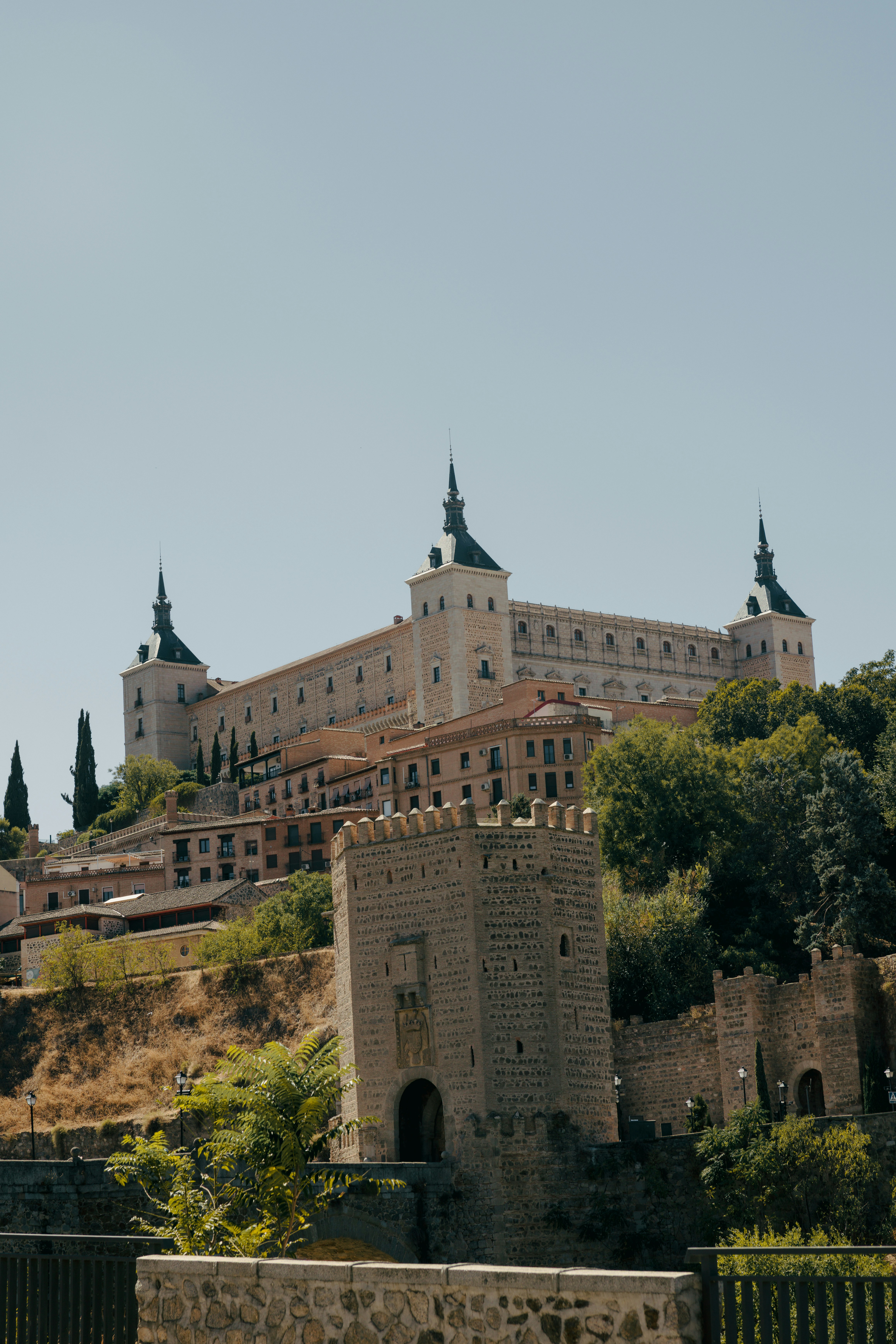 Castle on the Hill: A Turreted Fortress Overlooking the Walled Terrace