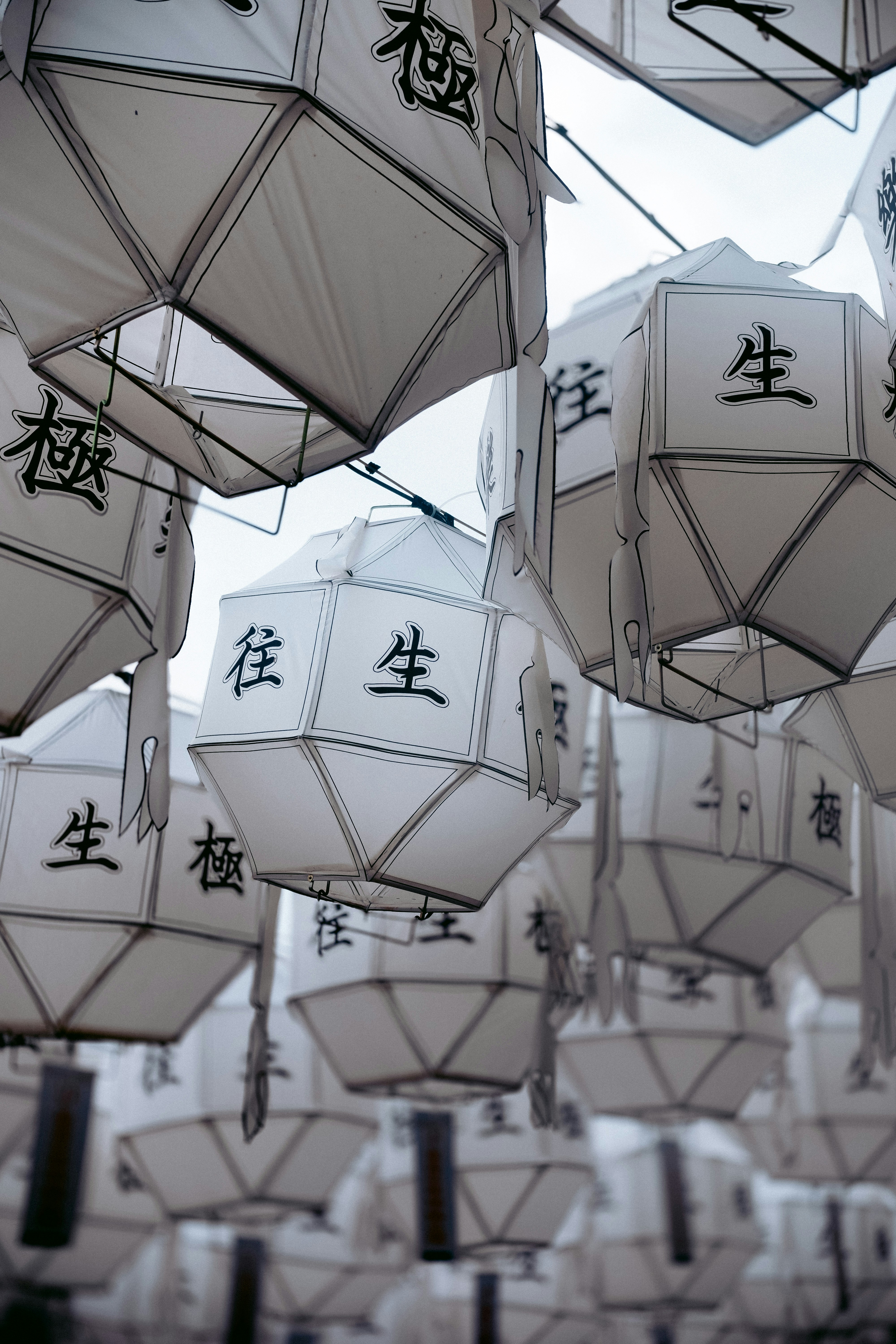 Lantern Resonance: Paper Lanterns Hover Over a Quiet Street