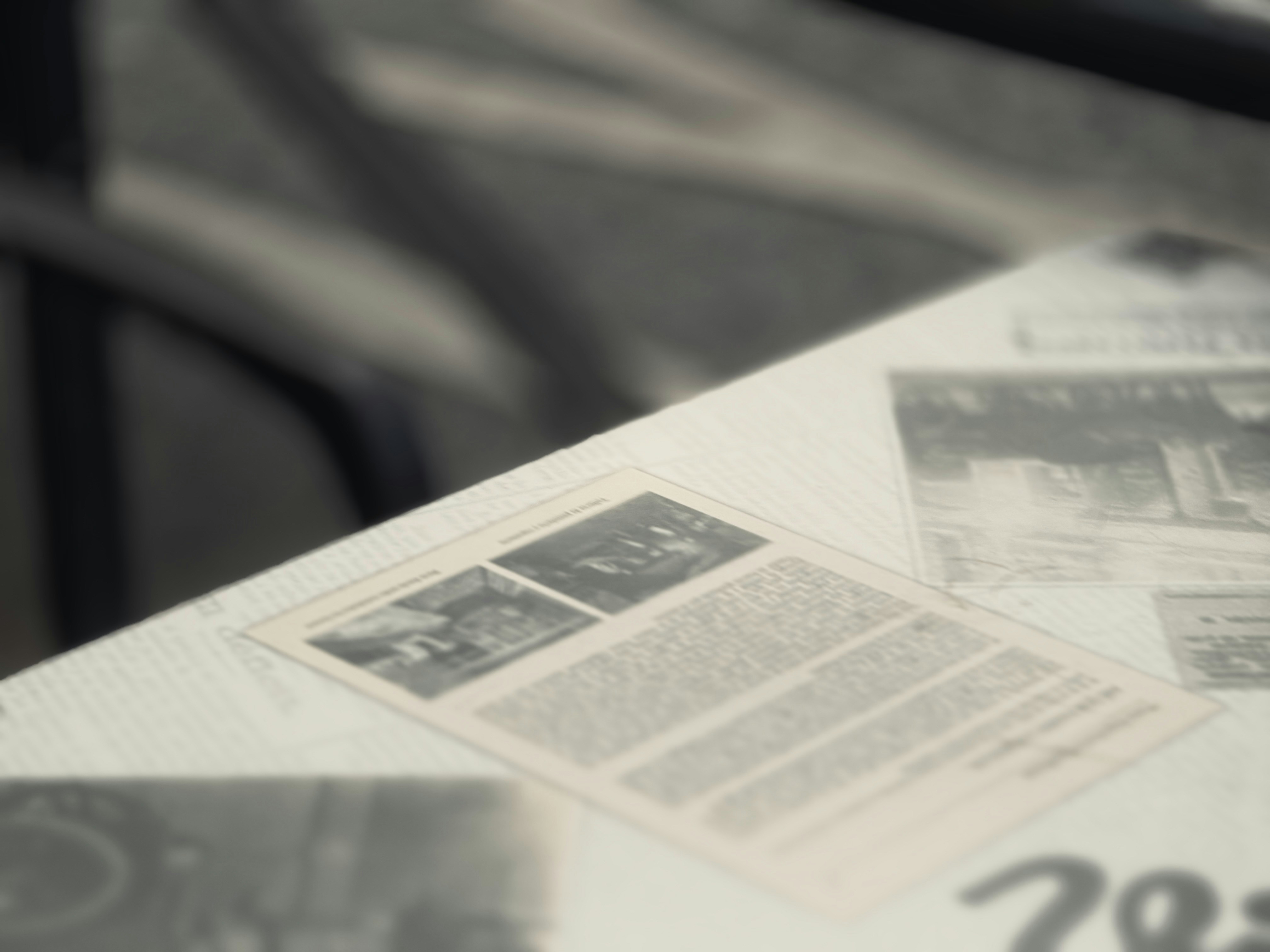 Fragmented Headlines: A Quiet Table of Newsprint