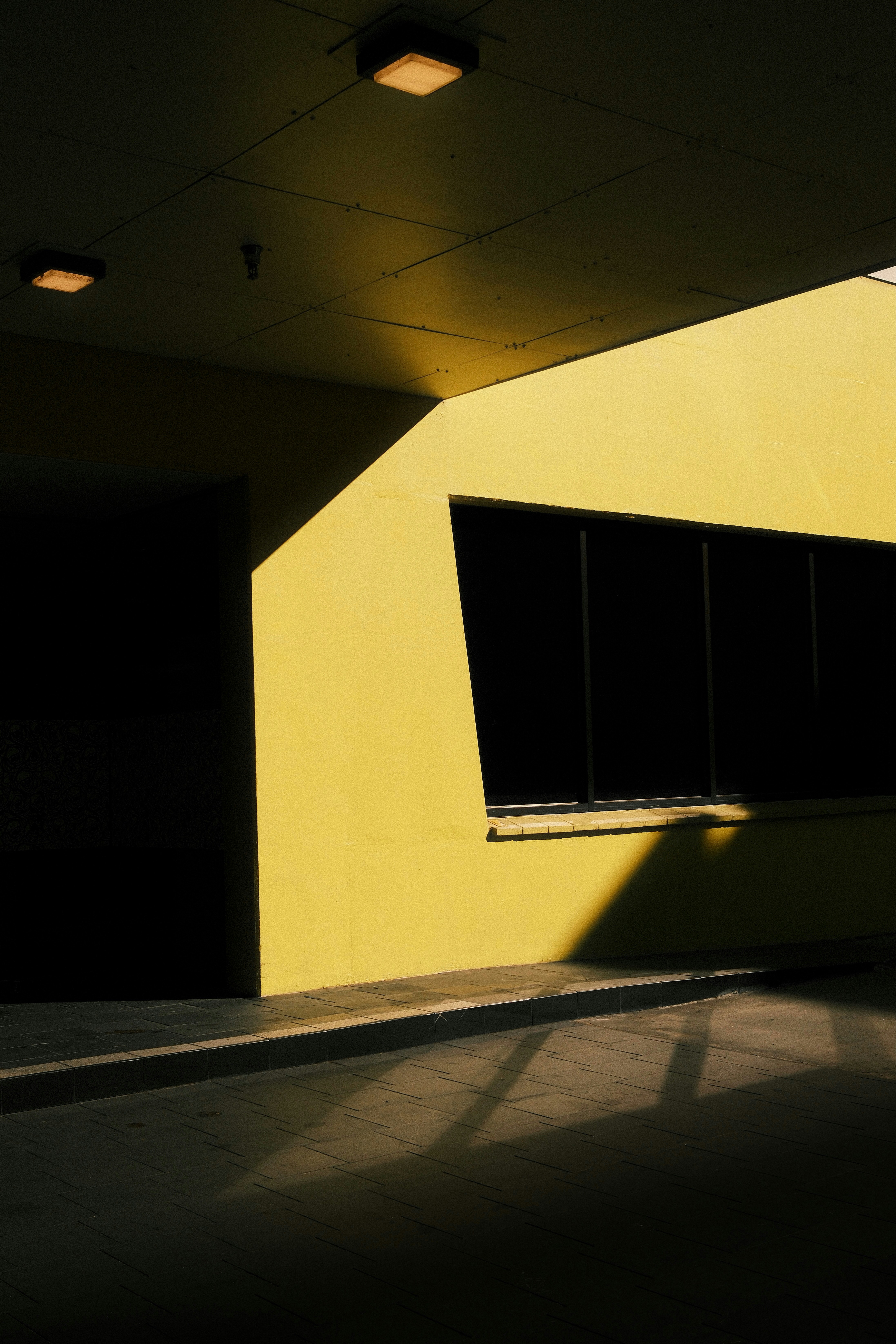Sunlit Angles on a Yellow Facade