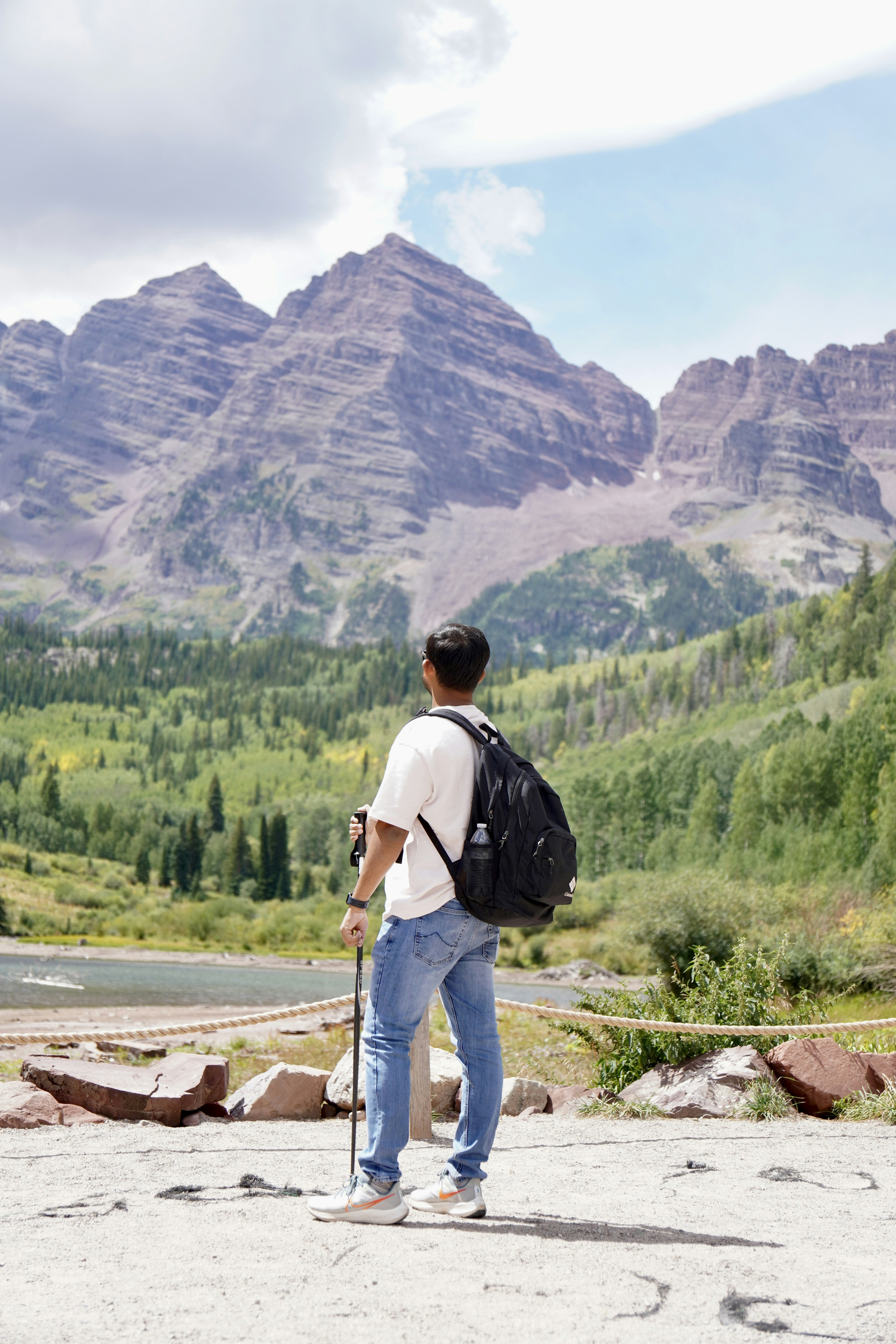 Hiker at the foothill amphitheatre under towering peaks
