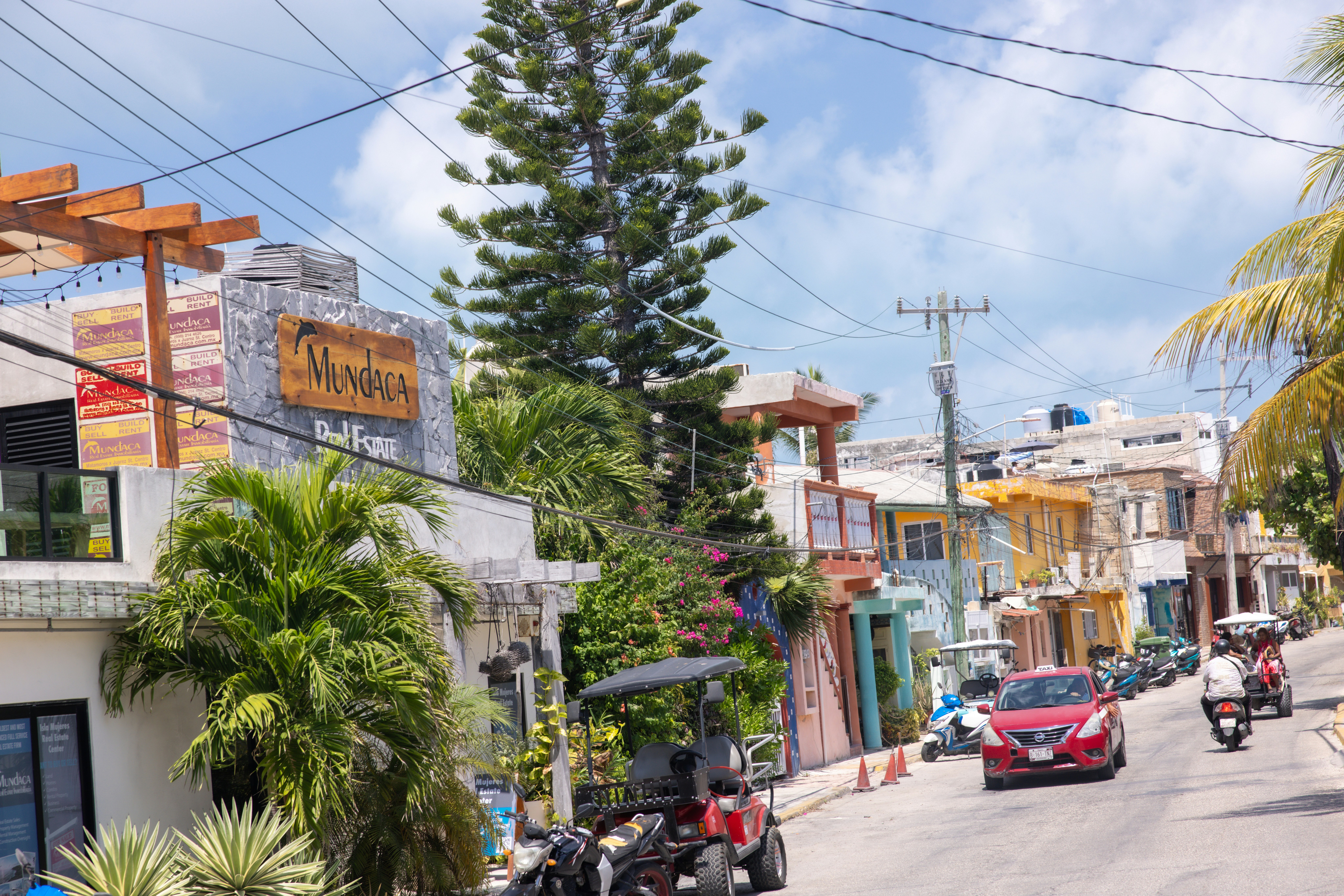 Coastal Lane: Sunlit Street in a Colorful Caribbean Town