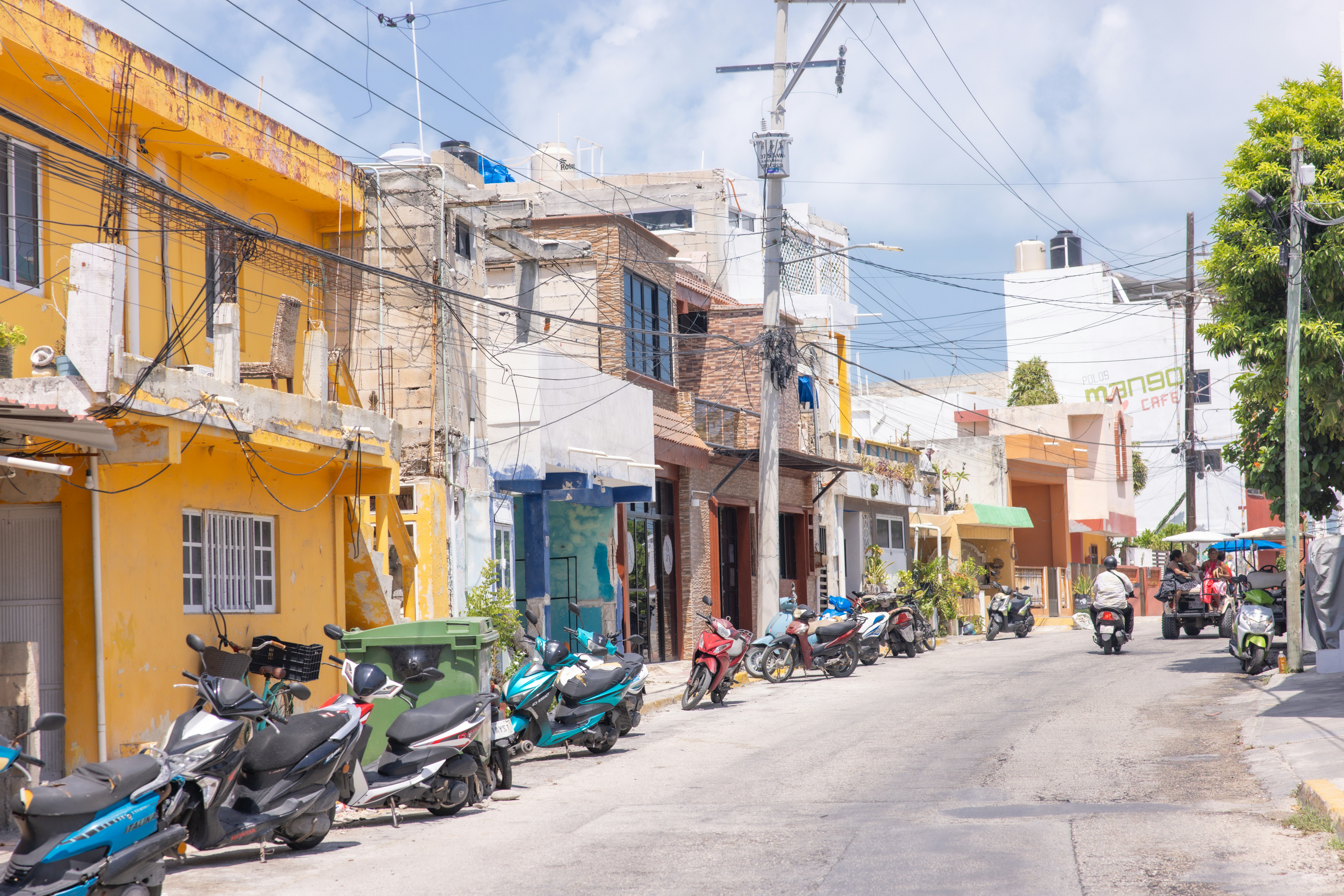 Colorful Street Corridor Packed with Scooters
