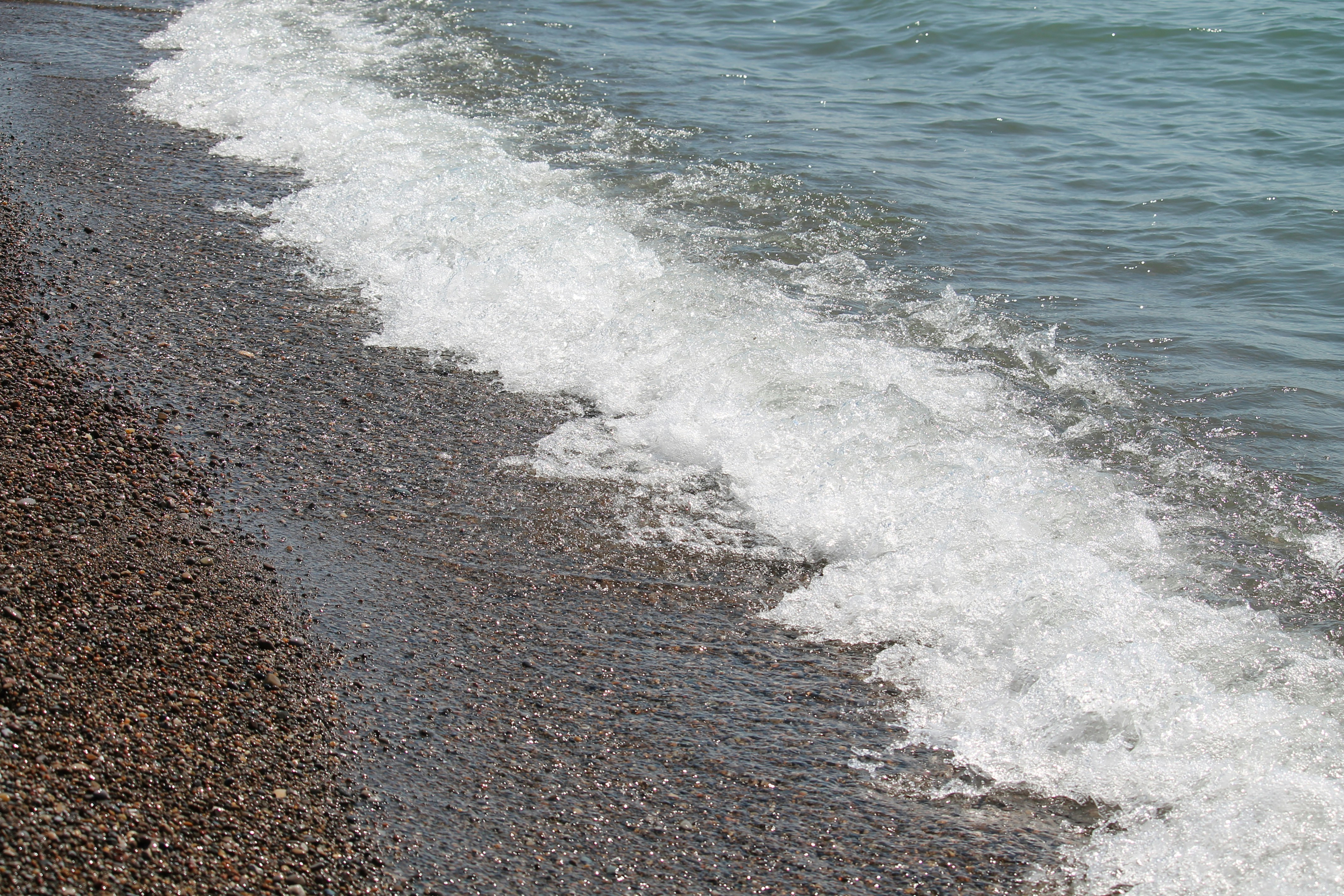 Pebble Beach Threshold: Waves Meet the Shoreline