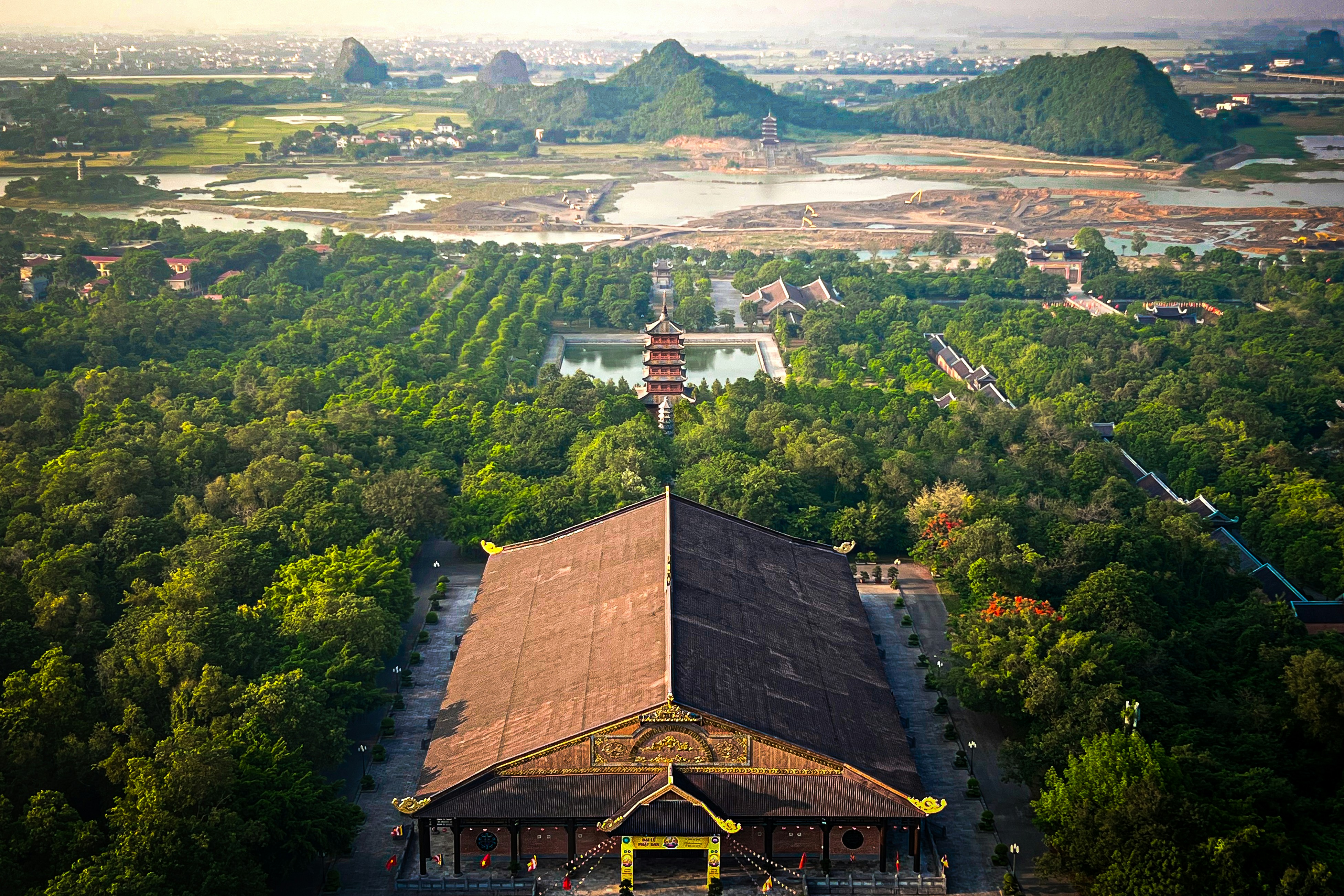 Temple Overlook: Aerial View of the Sacred Roof Framing a Verdant Valley