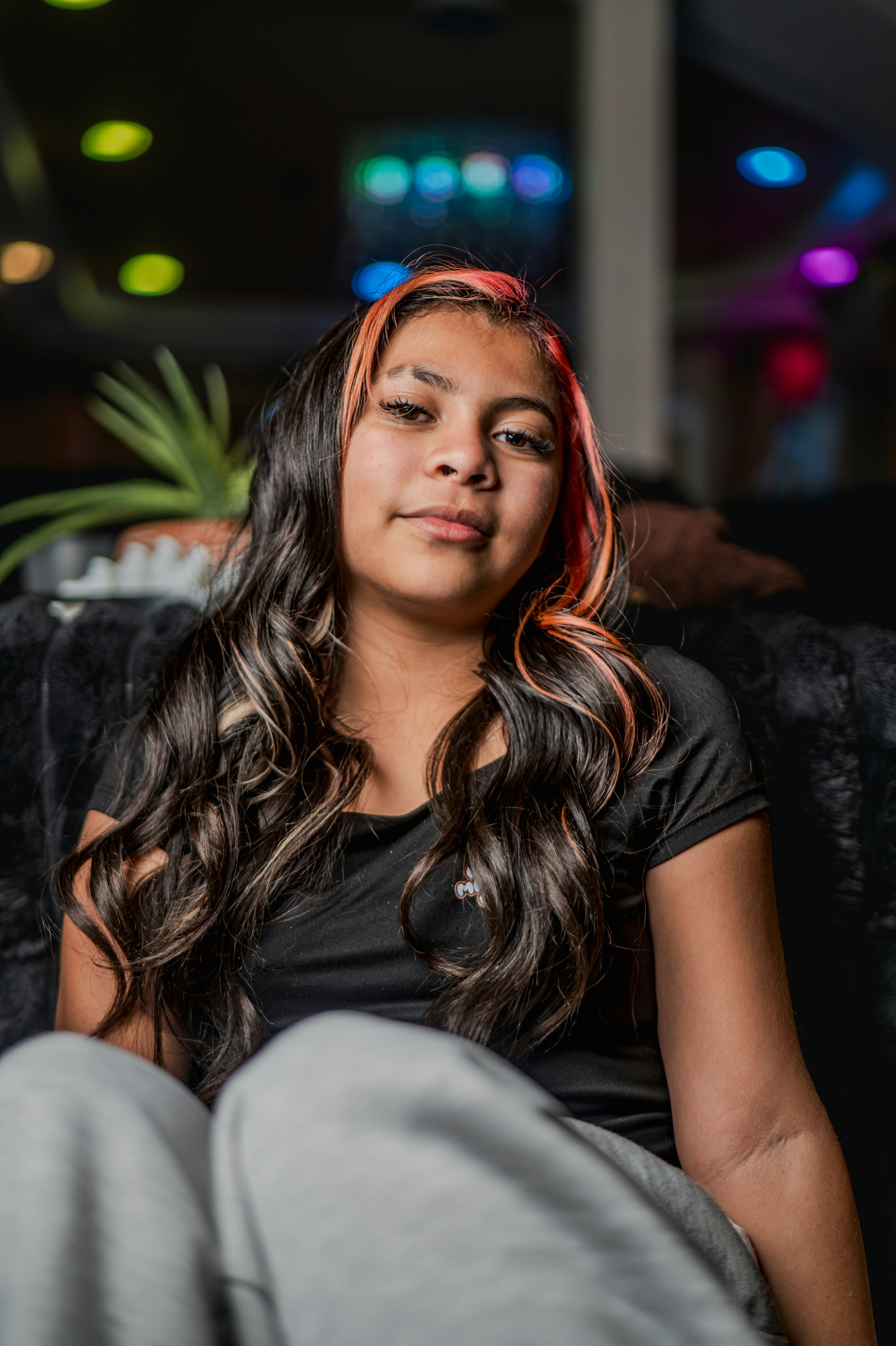 Soft-lit Portrait in a Neon-soaked Lounge