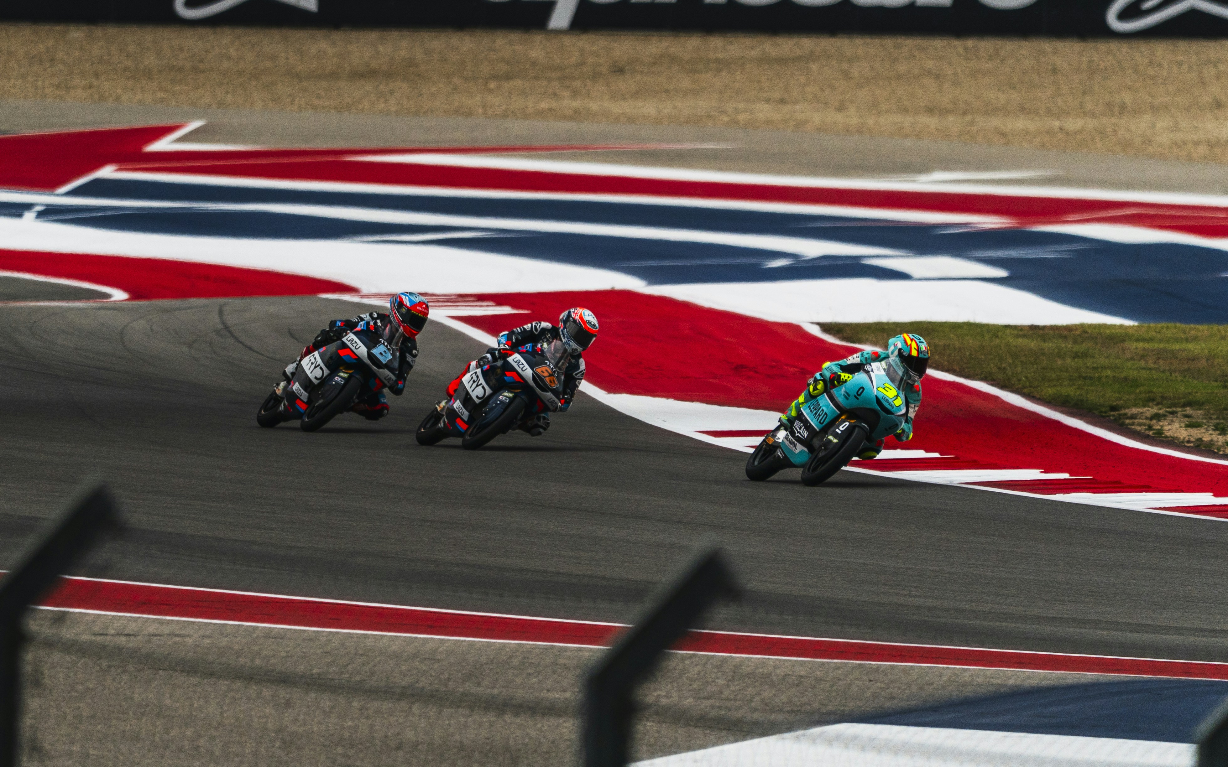 Tri‑Bike Drift: Champions Charging Through a Red, White, and Blue Rumble