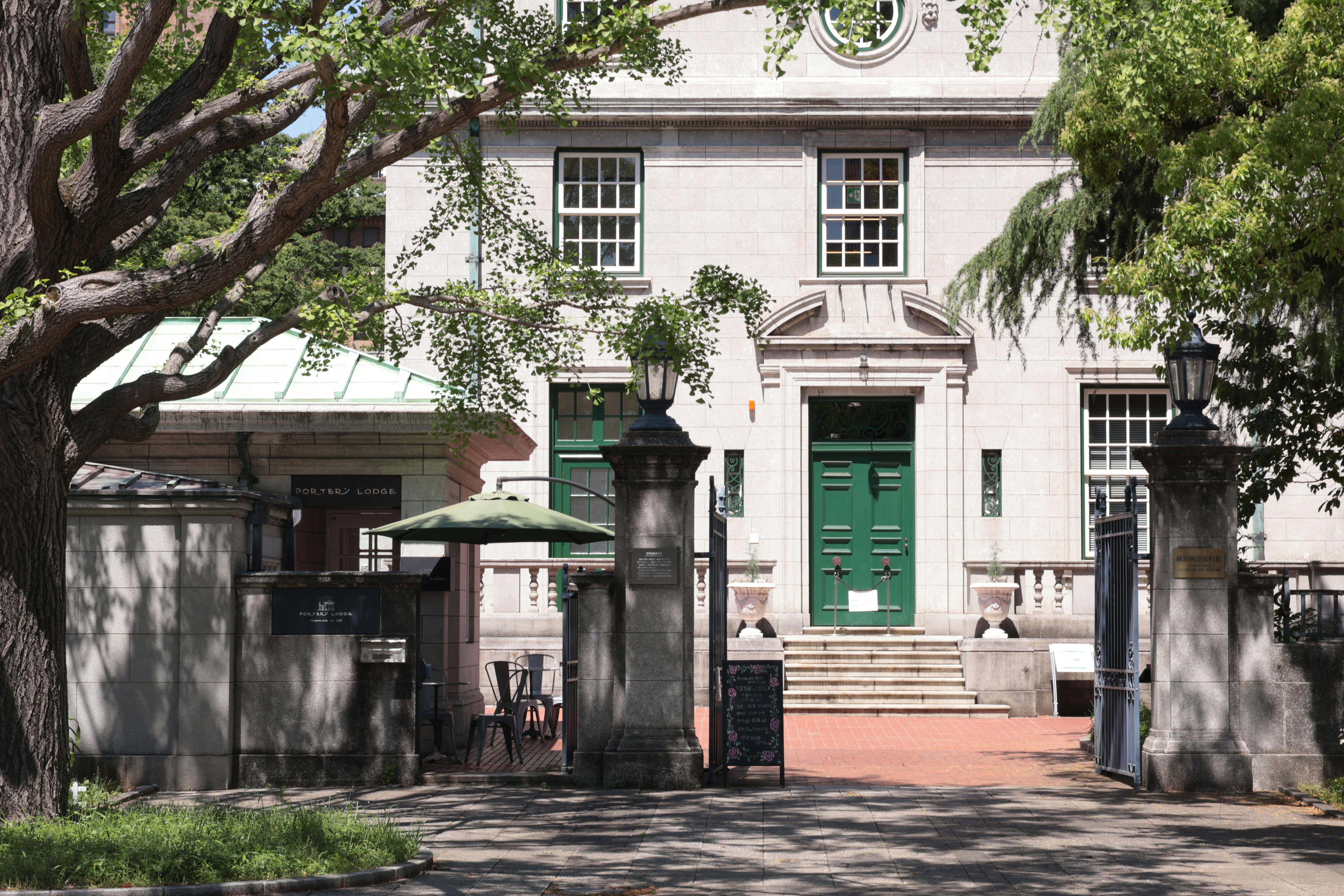 Historic doorway framed by shaded courtyard at a university campus