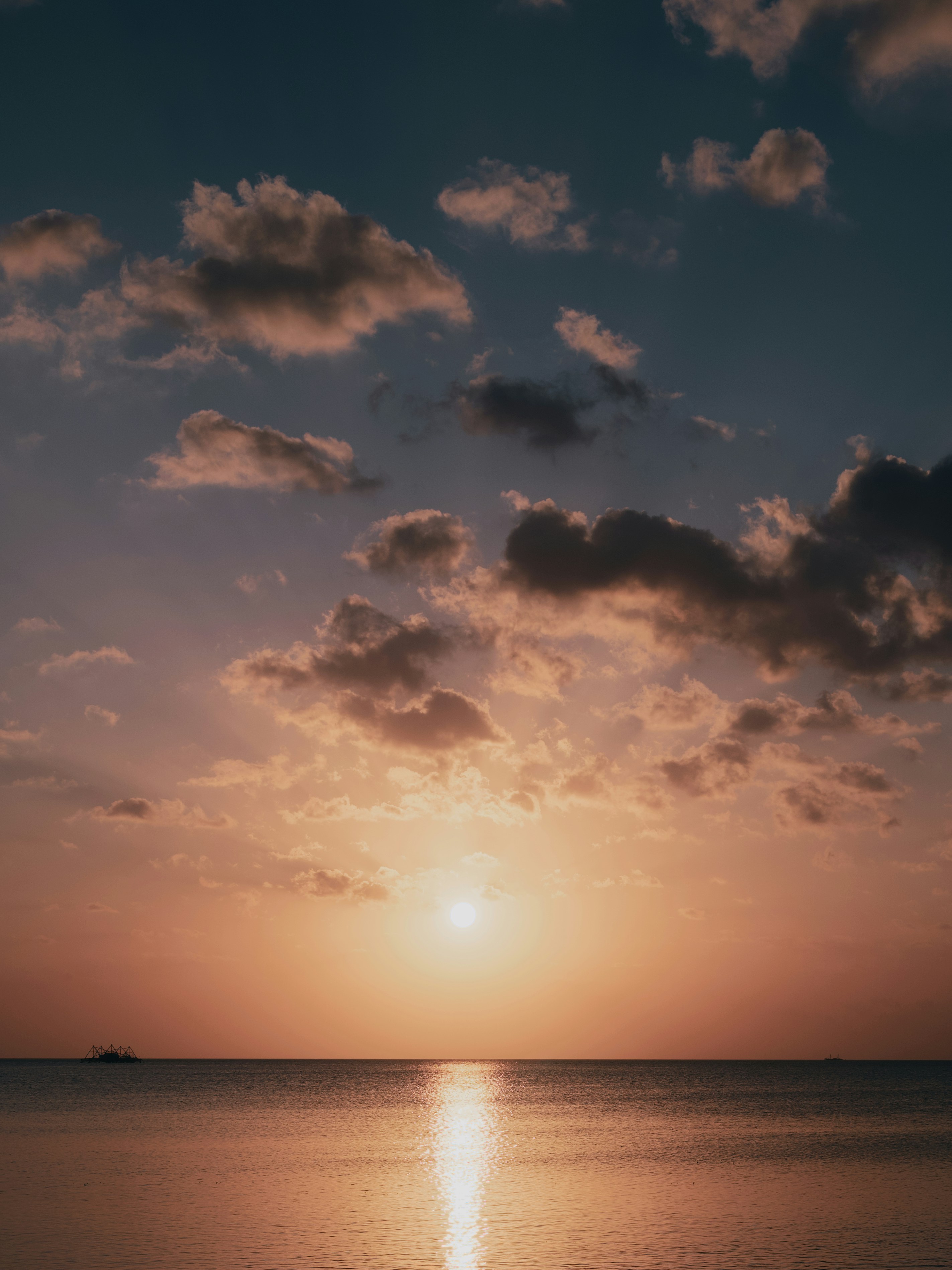 Sunset Mirror: Calm Sea with a Low Horizon and glowing orb