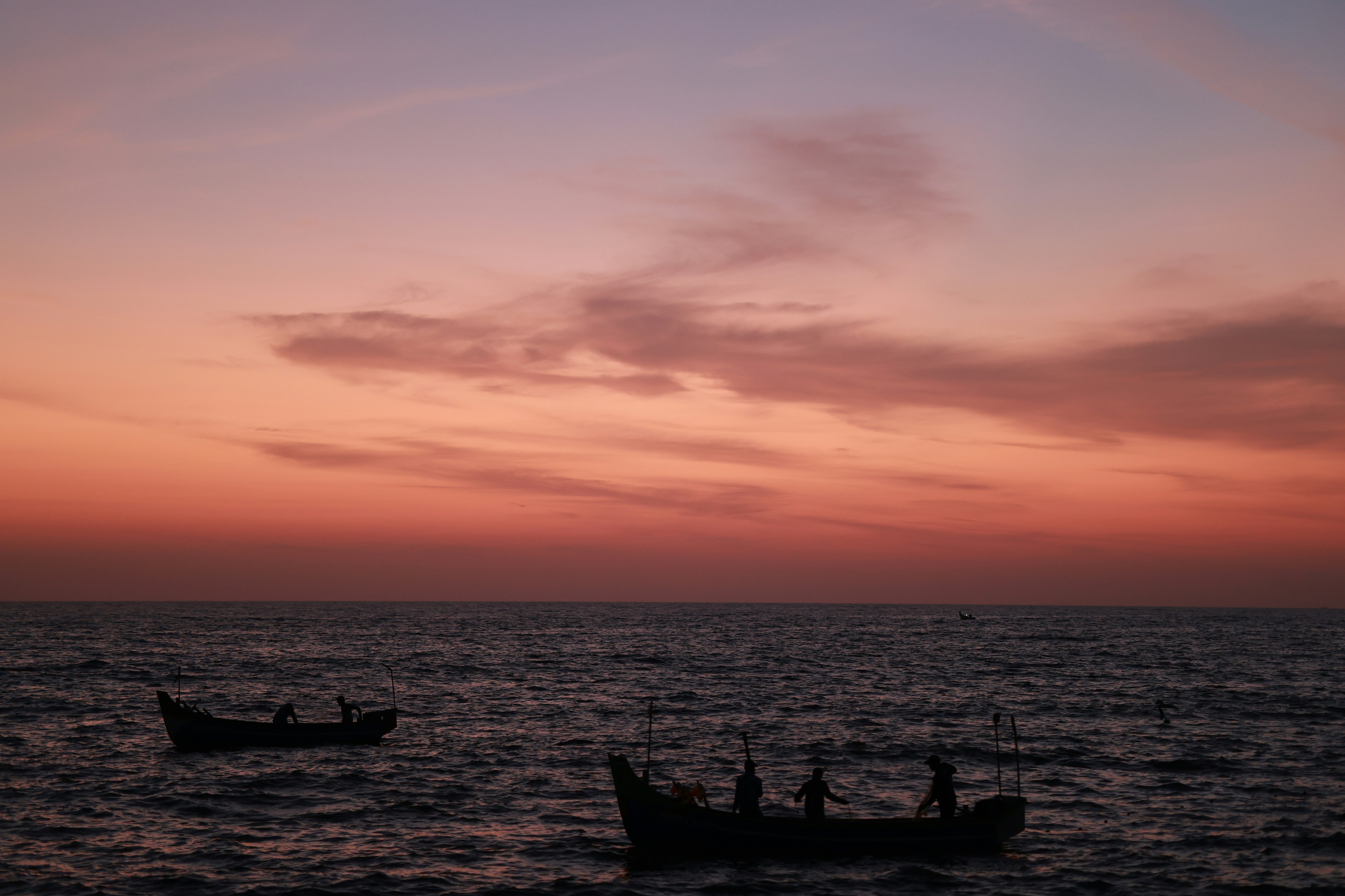 Silhouetted Boats on a Velvet Horizon at Sunset