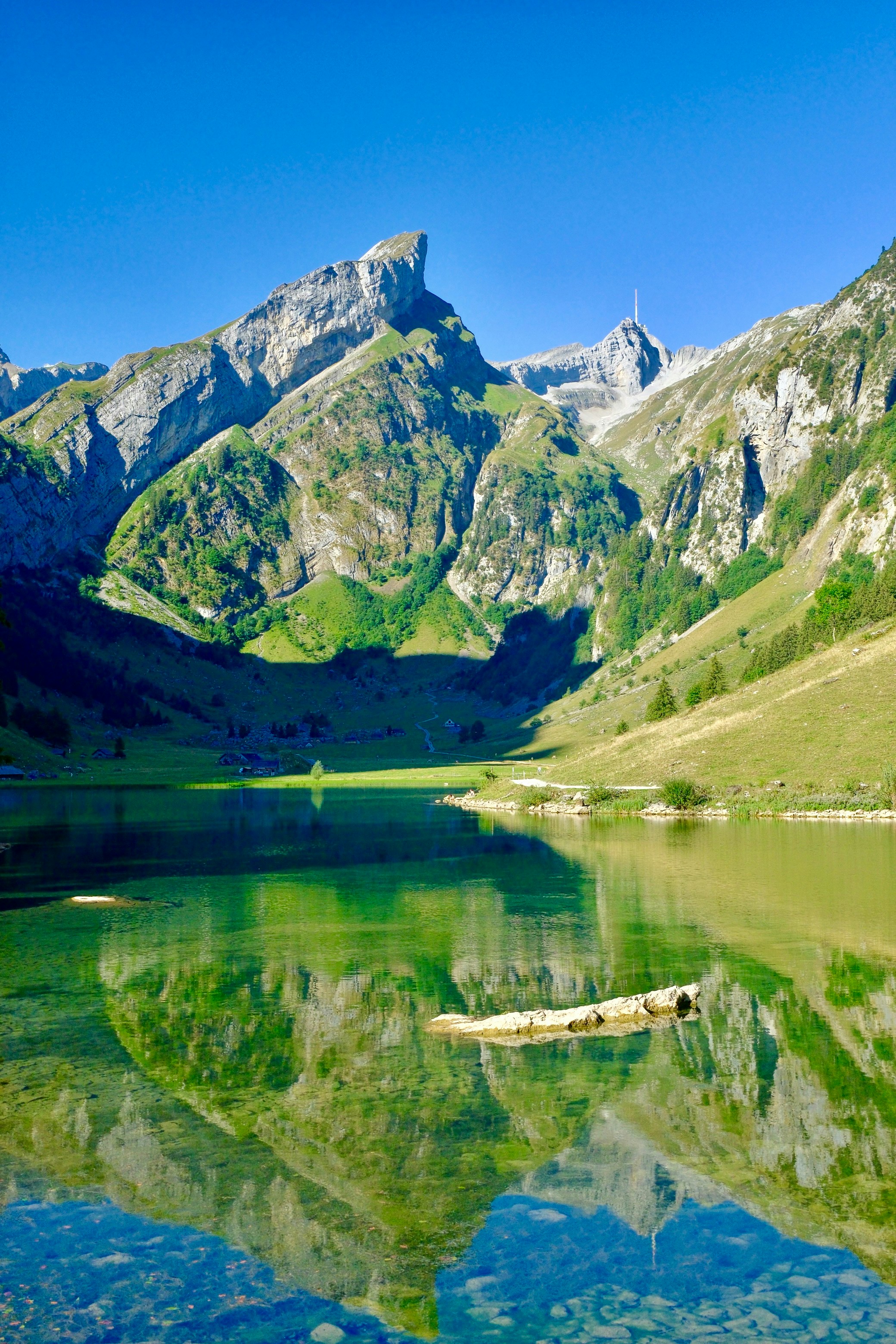 Echoes of the Valley: A Glacial Mirror Under Azure Skies