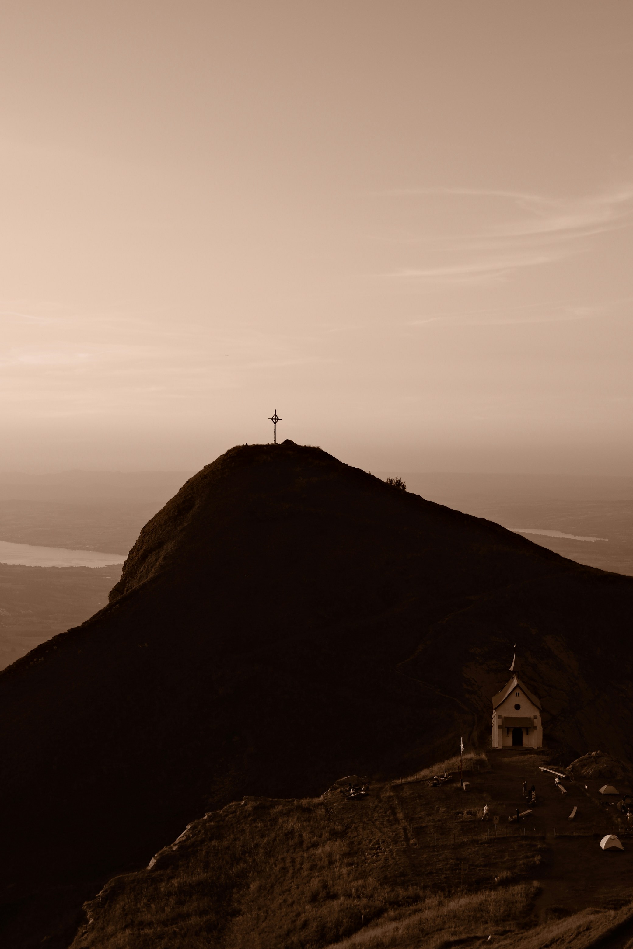 Cross on the Crest: A Silent Summit at Sunset