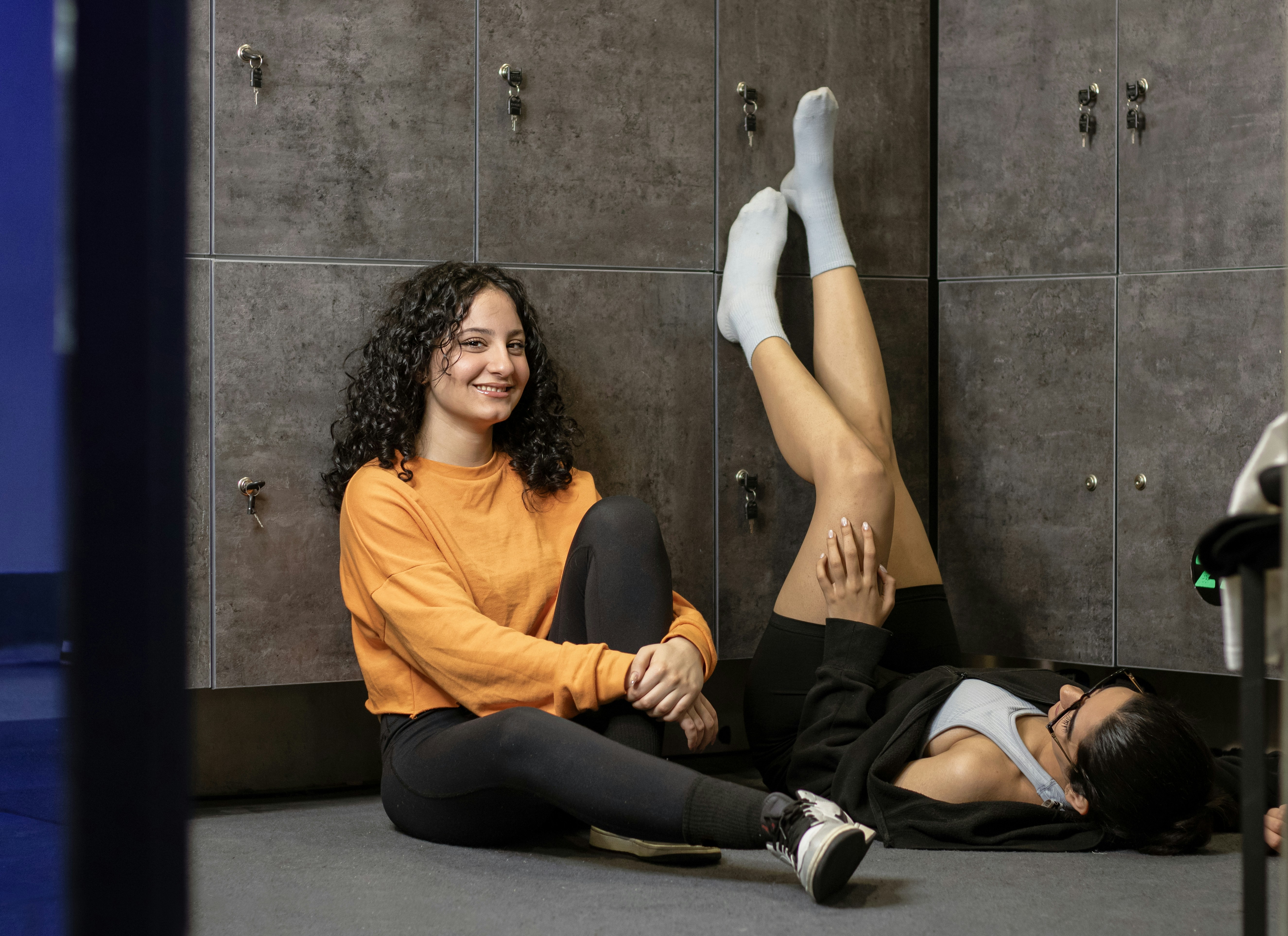 Locker Room Laughter: A Quiet Moment of Friendship in the Gym