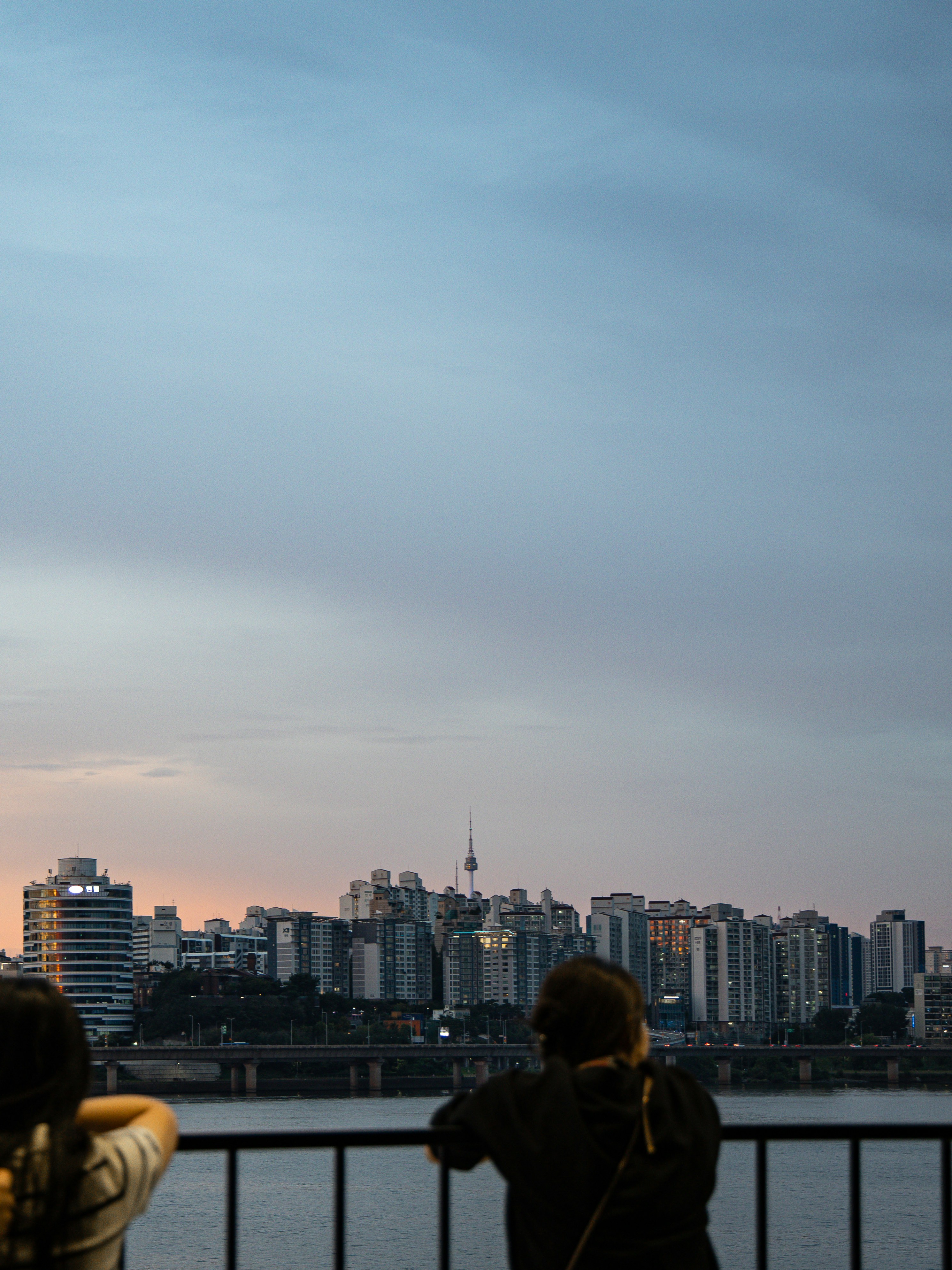 Night Sky Over the River: City Silhouette and Watching Figures
