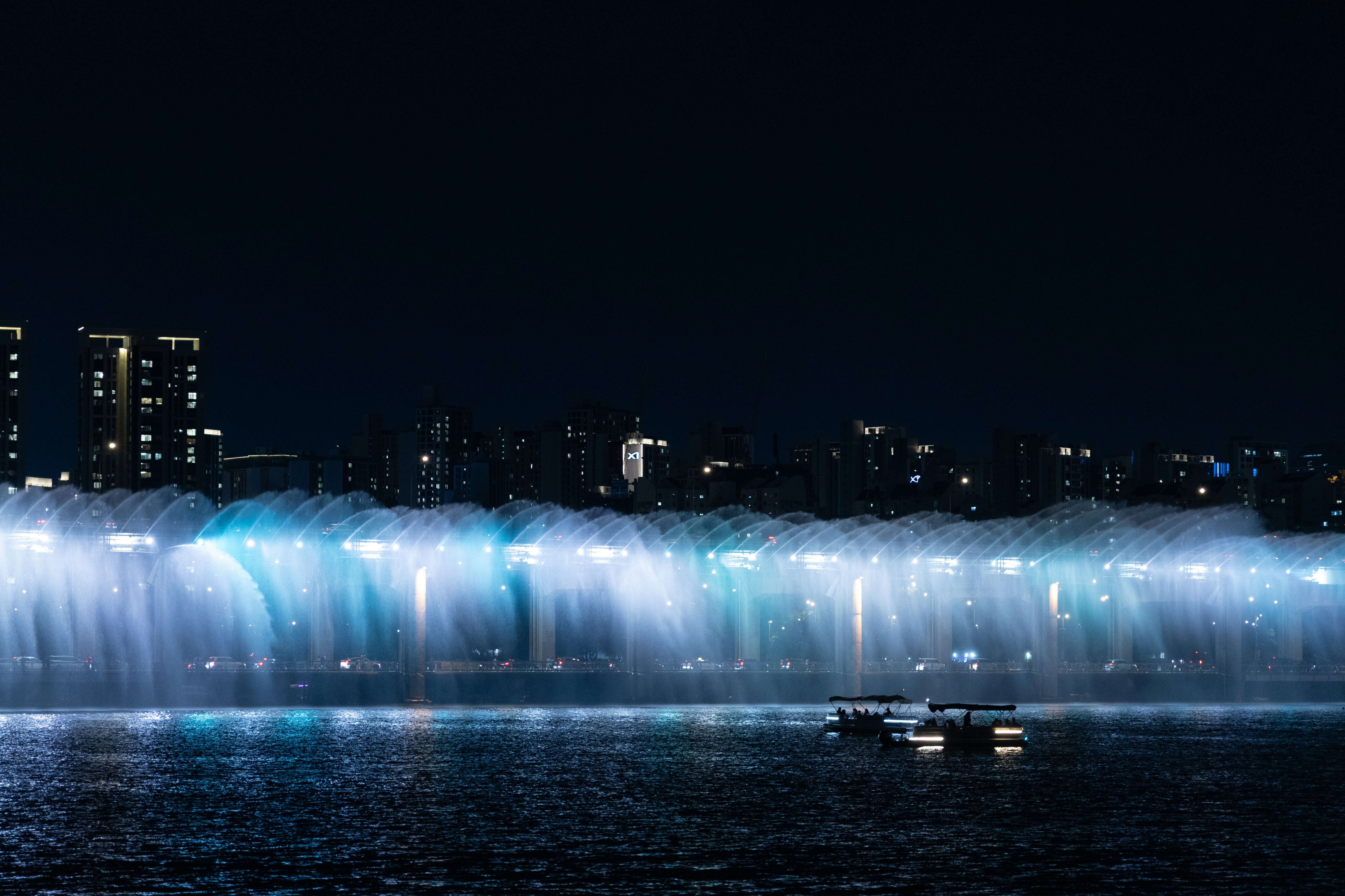 Neon Cascade Over the Marina