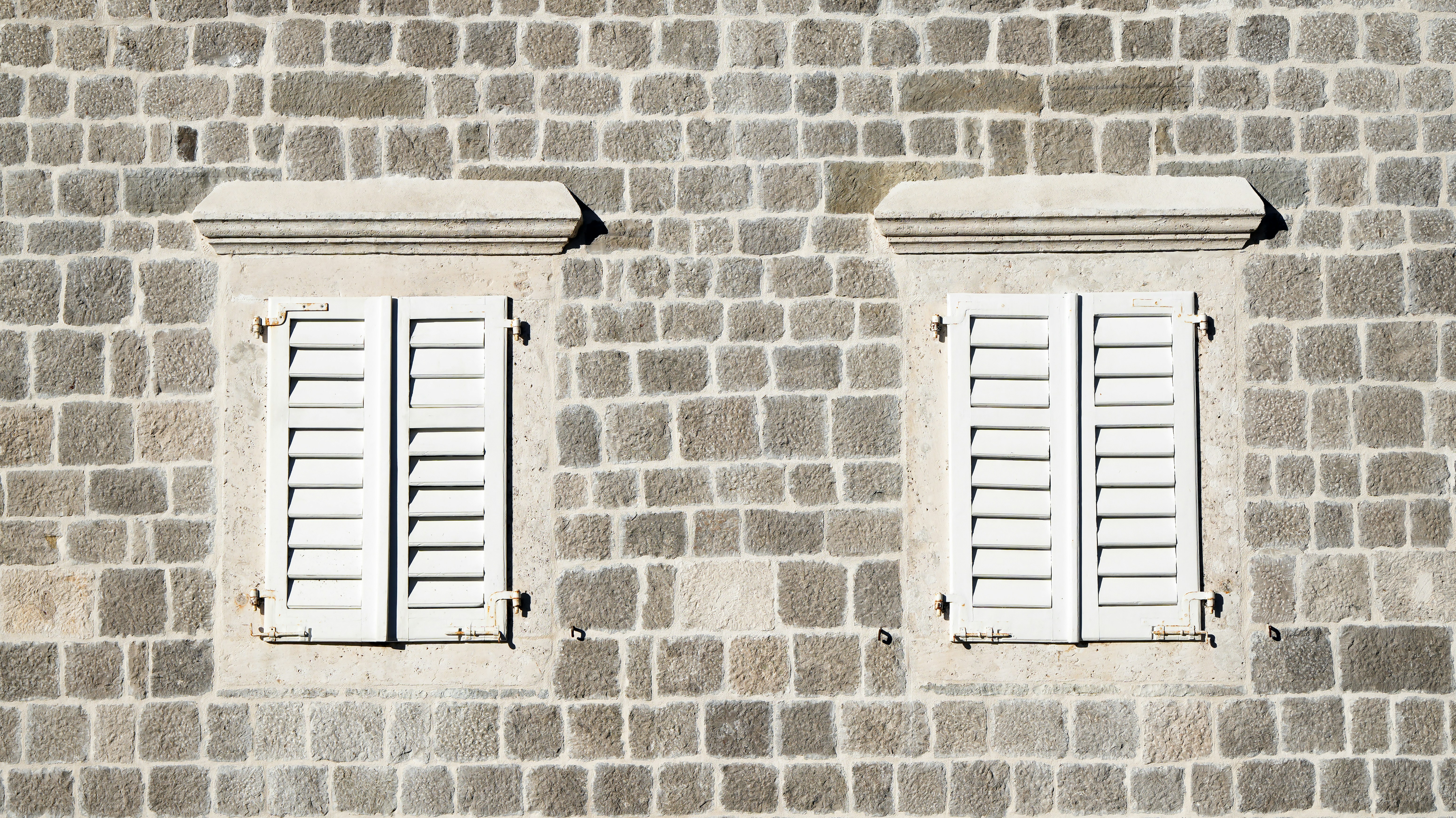 Stone Facade with Paired Shutter Windows