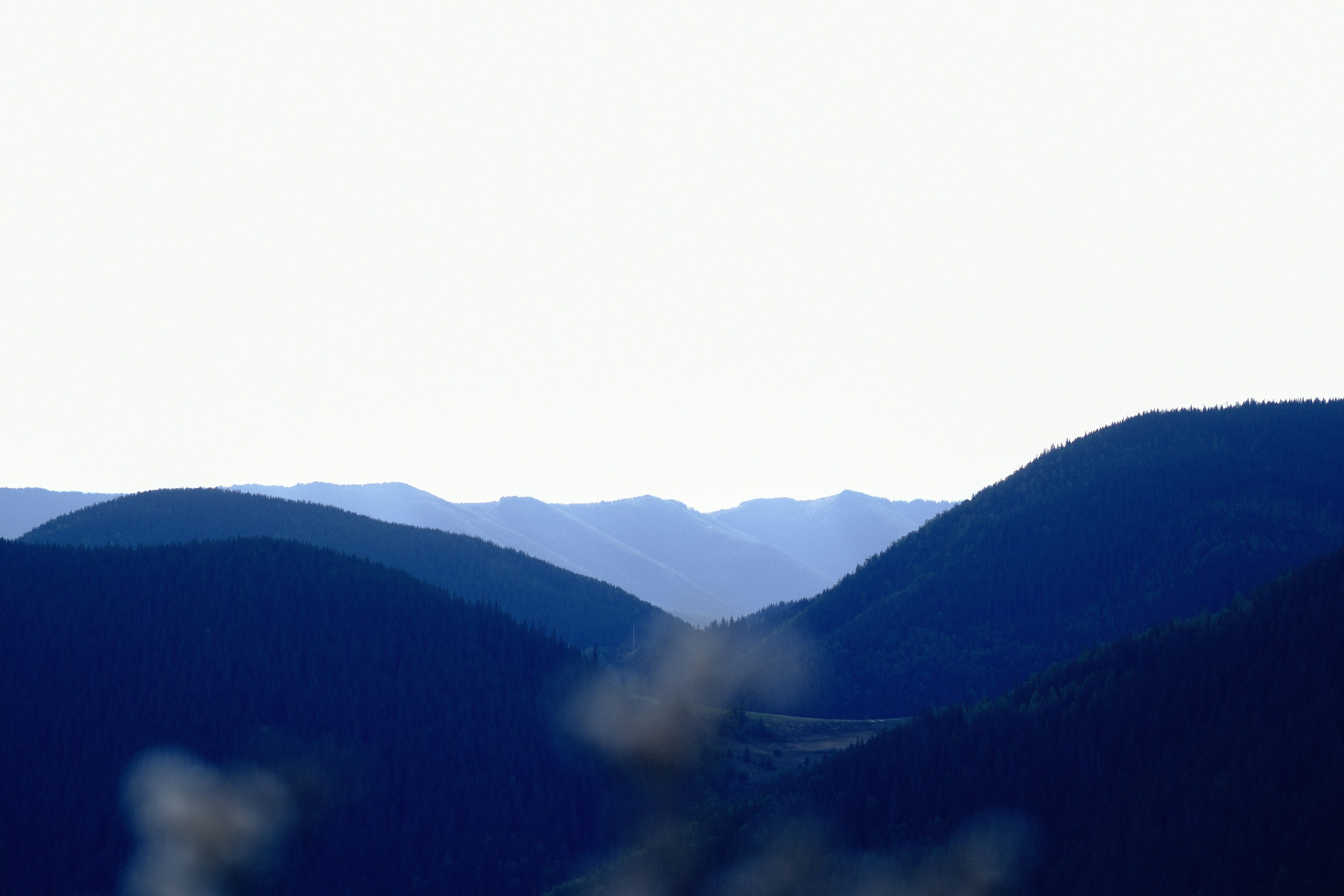 Layers of Quiet Blue: Mountain Ranges Leaning into Distant Light
