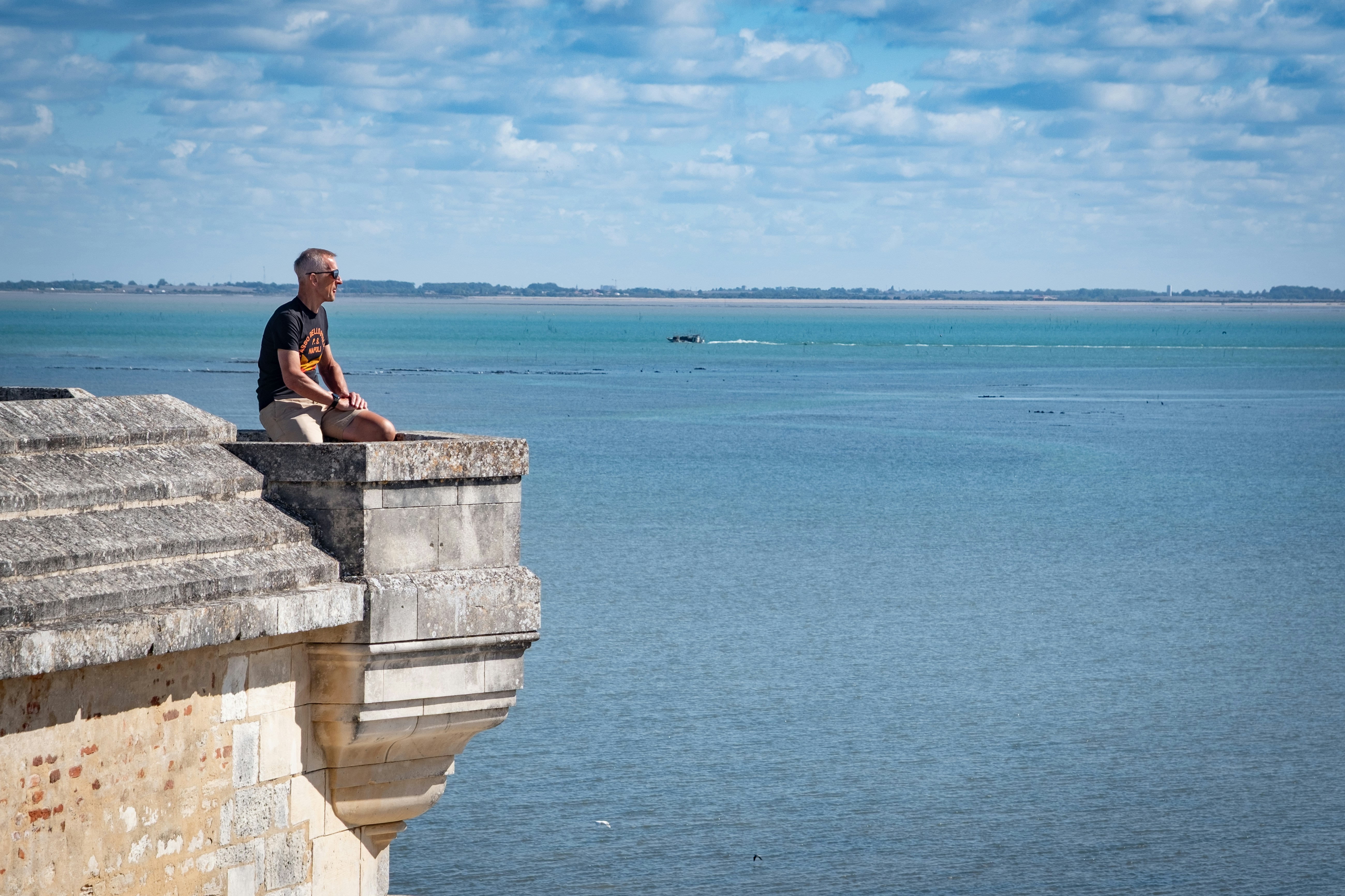 Littoral Watch: A solitary figure on wind-washed stone