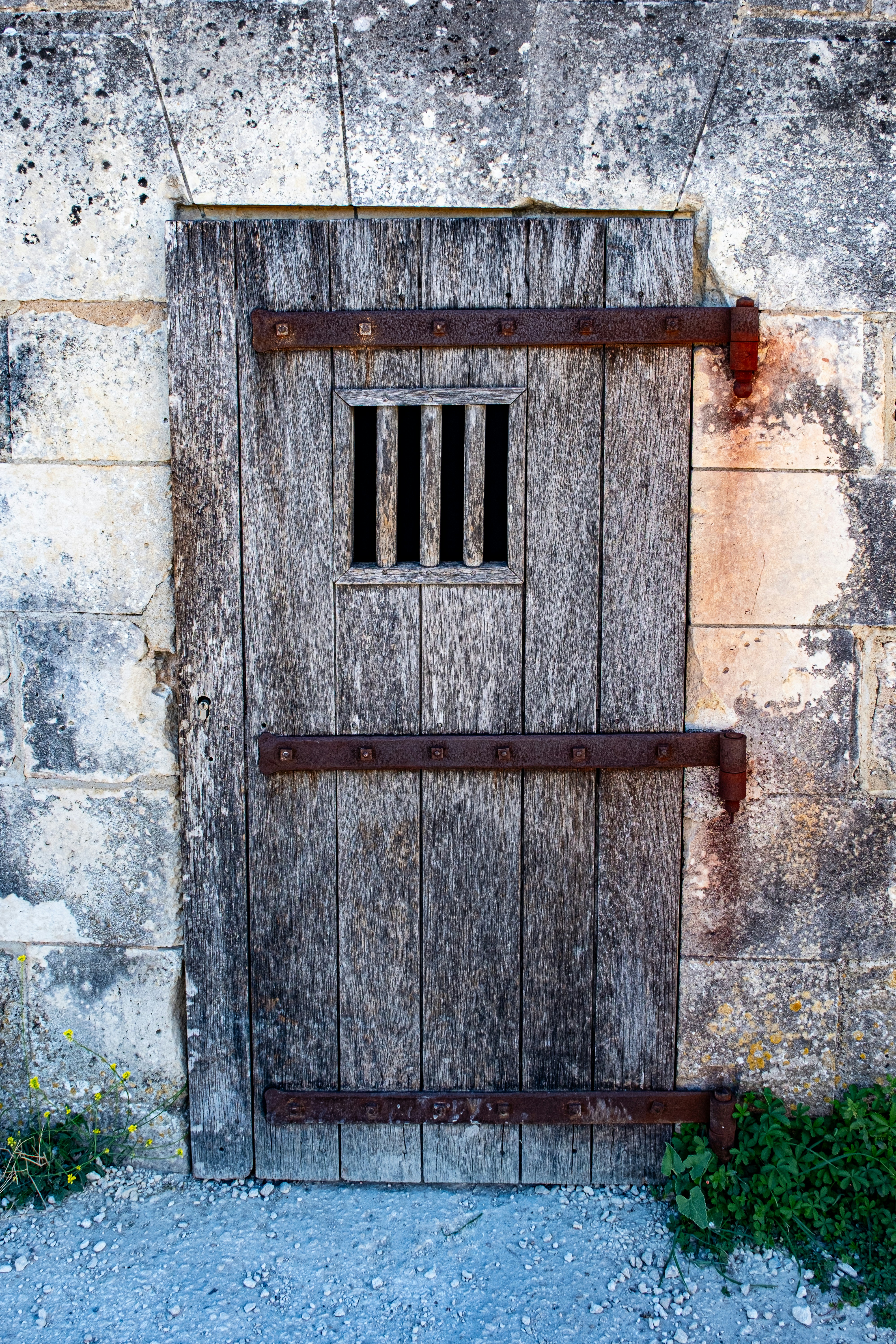 Weathered Gate: A Quiet Doorway to an Old Stone Wall