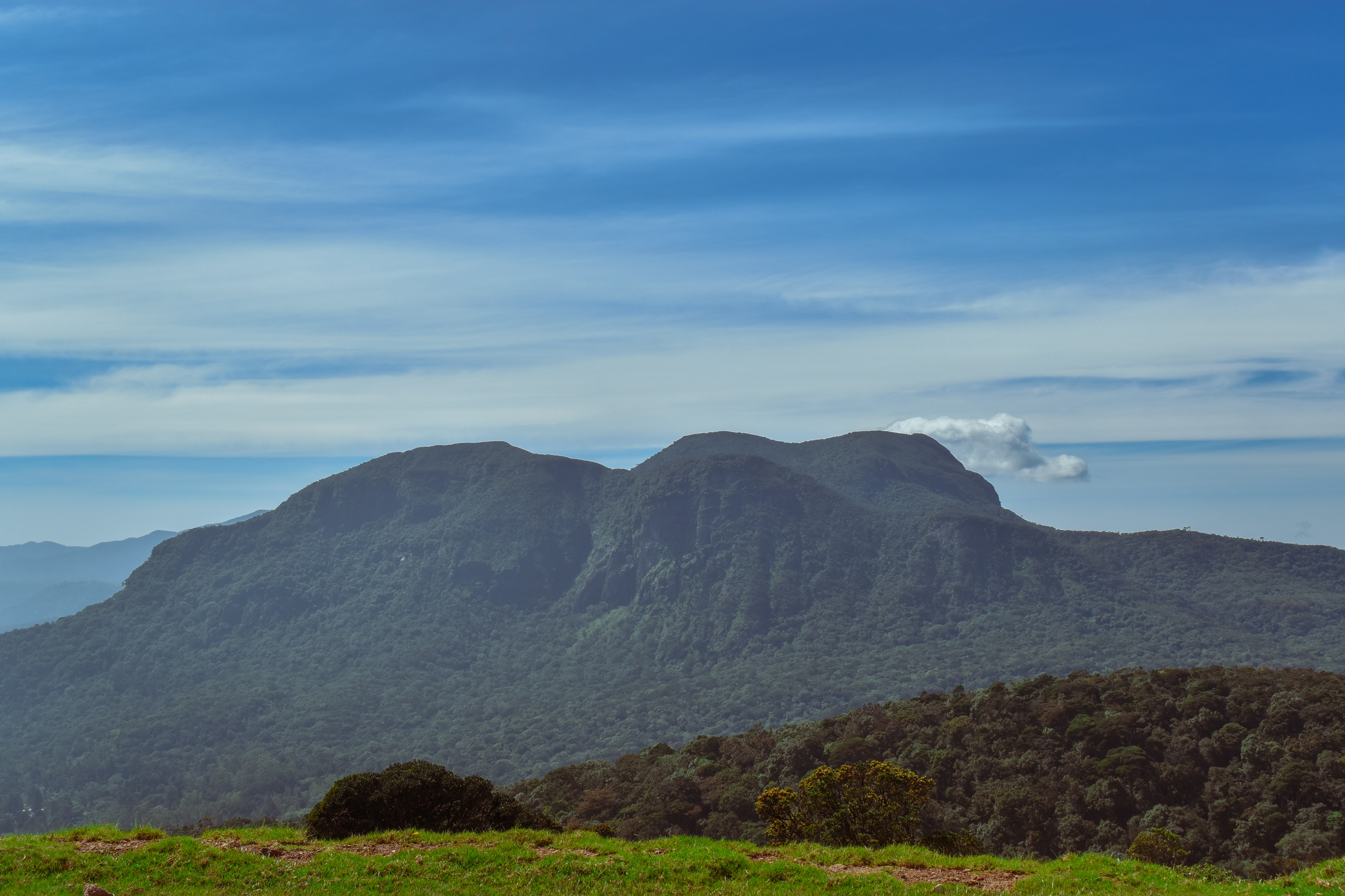 Majestic Ridge: A Twin-Peaked Summit Quietly Reigning Over Rolling Foothills