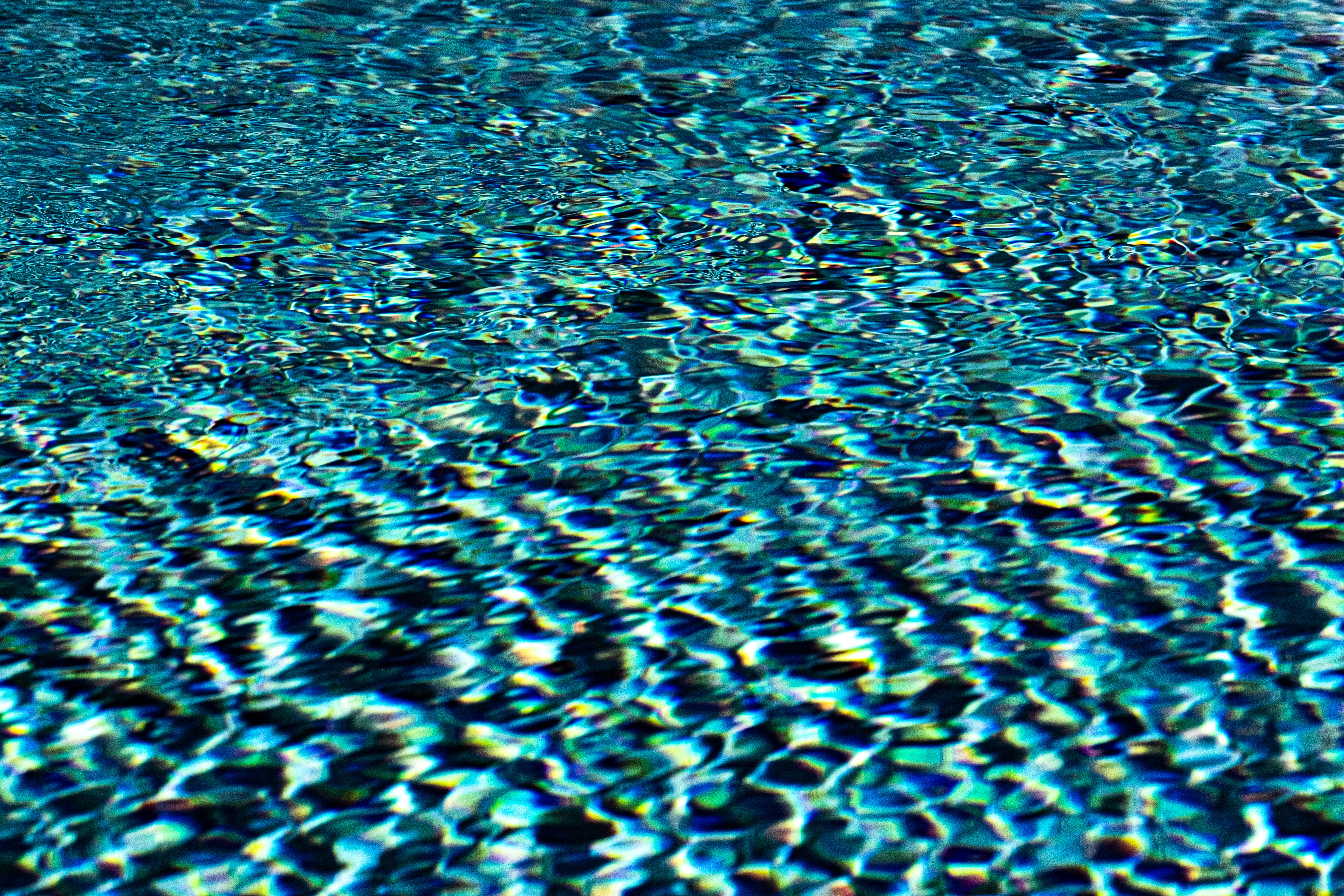 Sunlit Sapphire Ripples: A Close Study of Pool Light Dancing