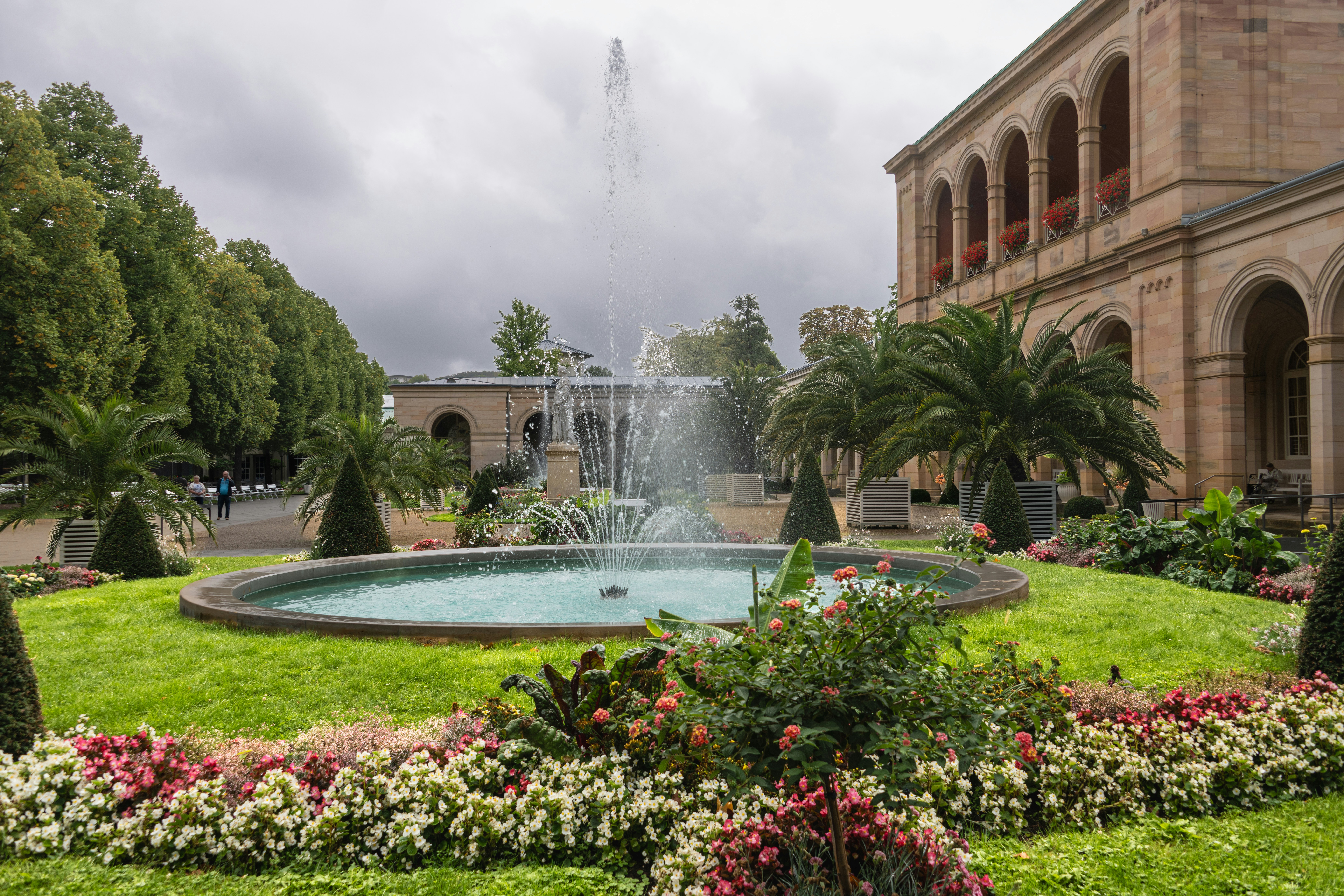 Symphony of Tile and Foliage: A Fountain Courtyard at Dusk