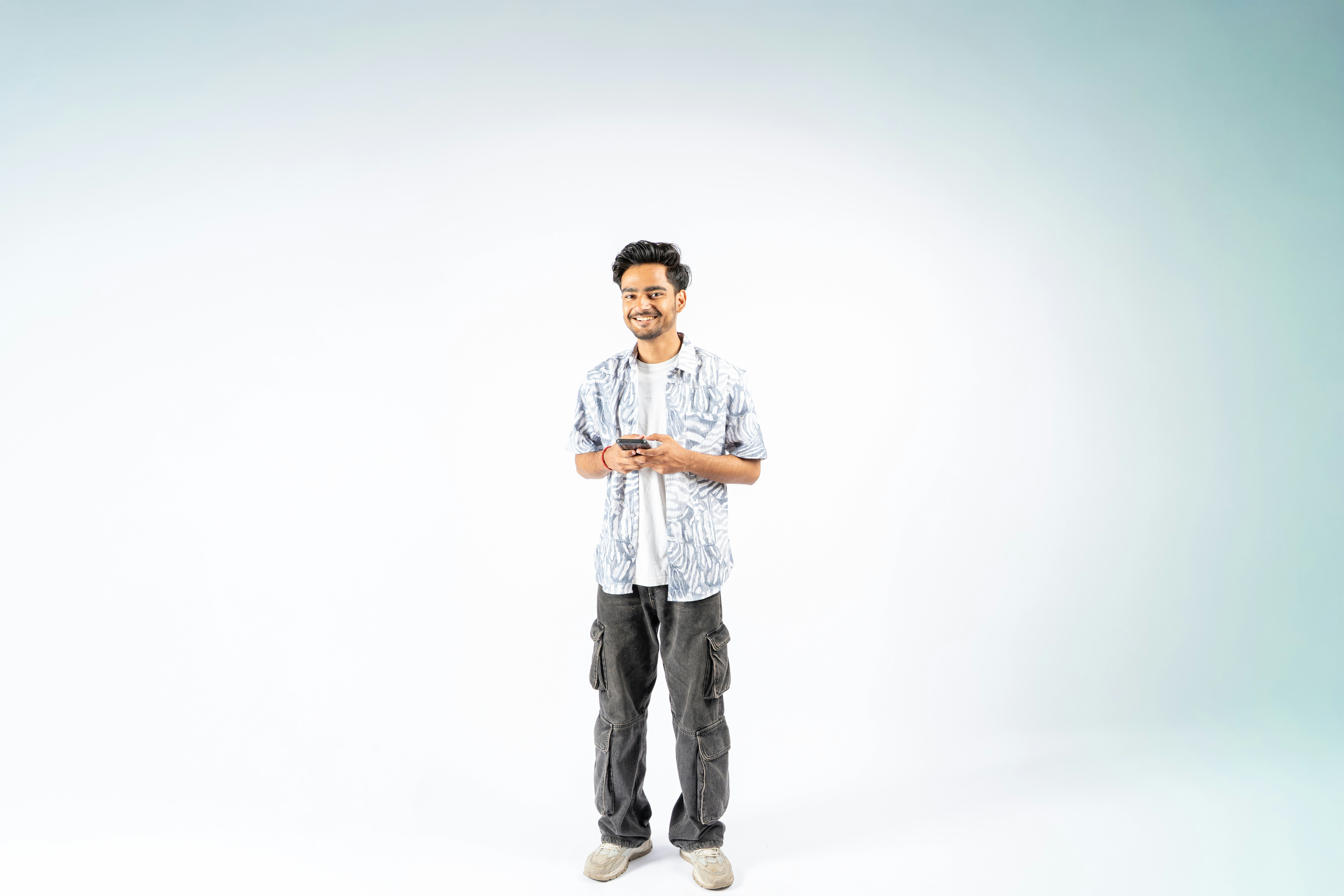 Casual Confidence: A Young Man in a Light Studio Glow