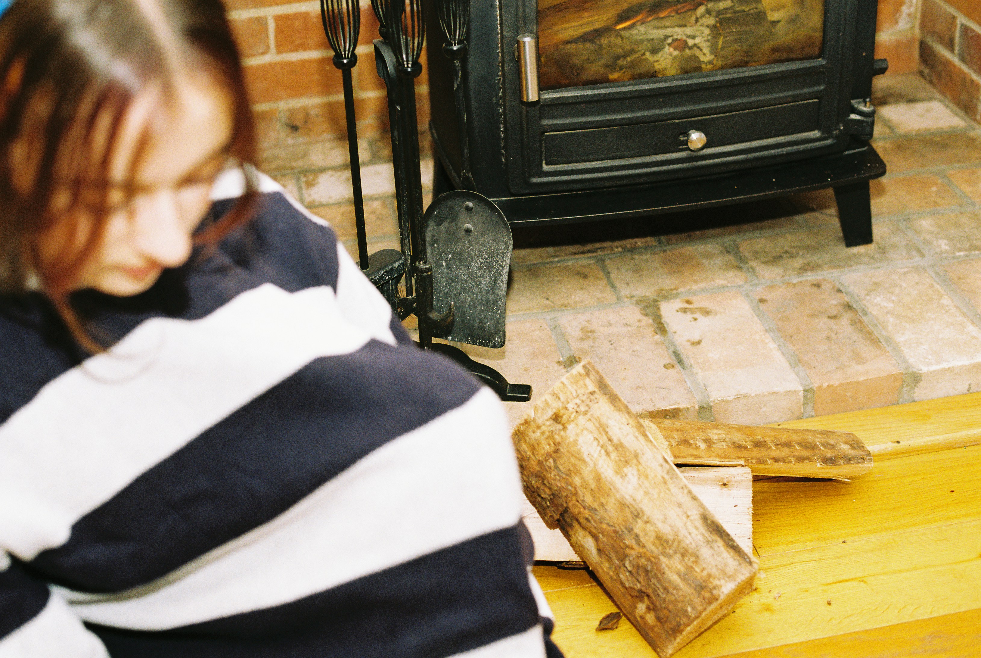 Cozy Firelight Interrupted: A Portrait by the Hearth
