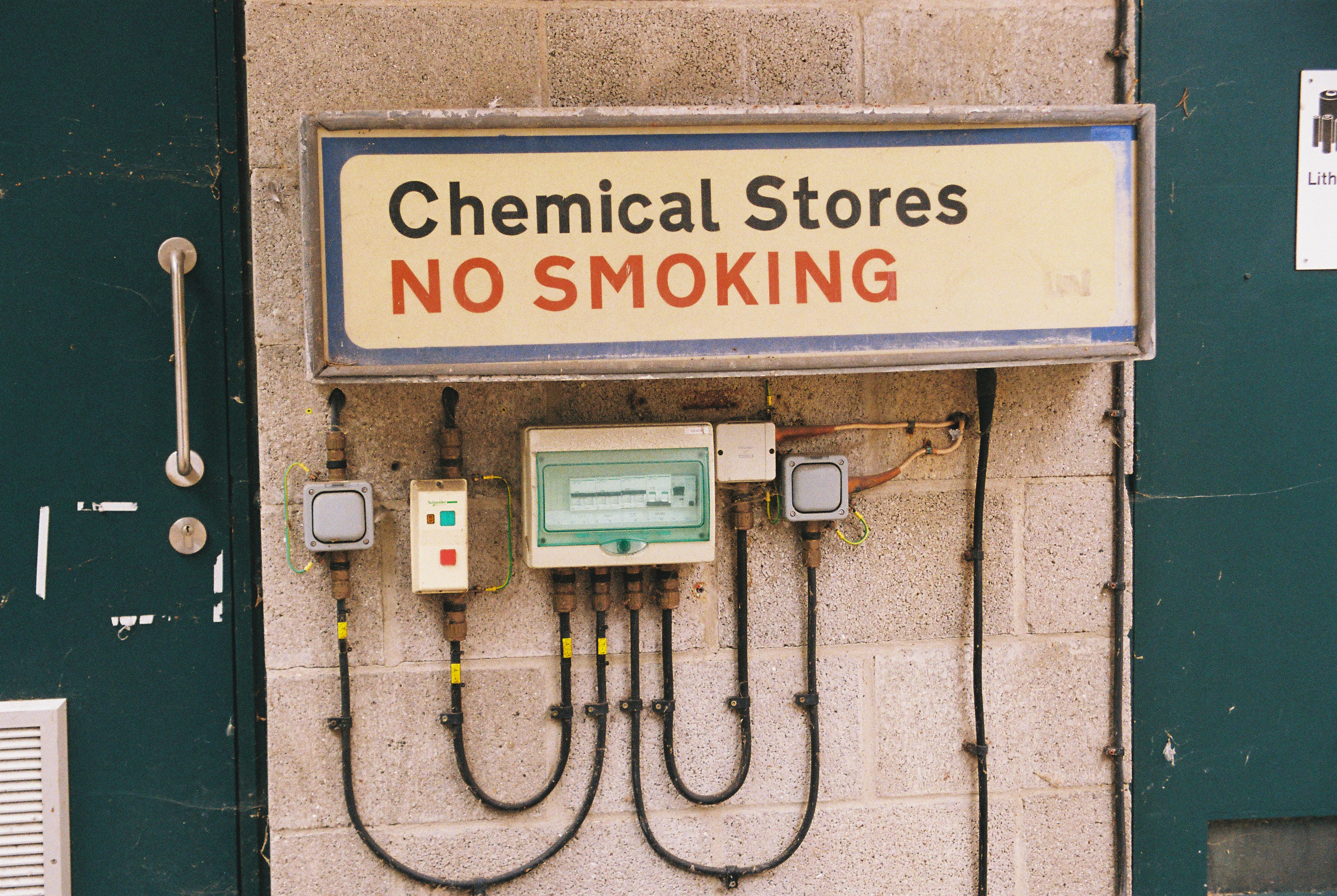 No Smoking Sign Above a Wall of Utility Meters