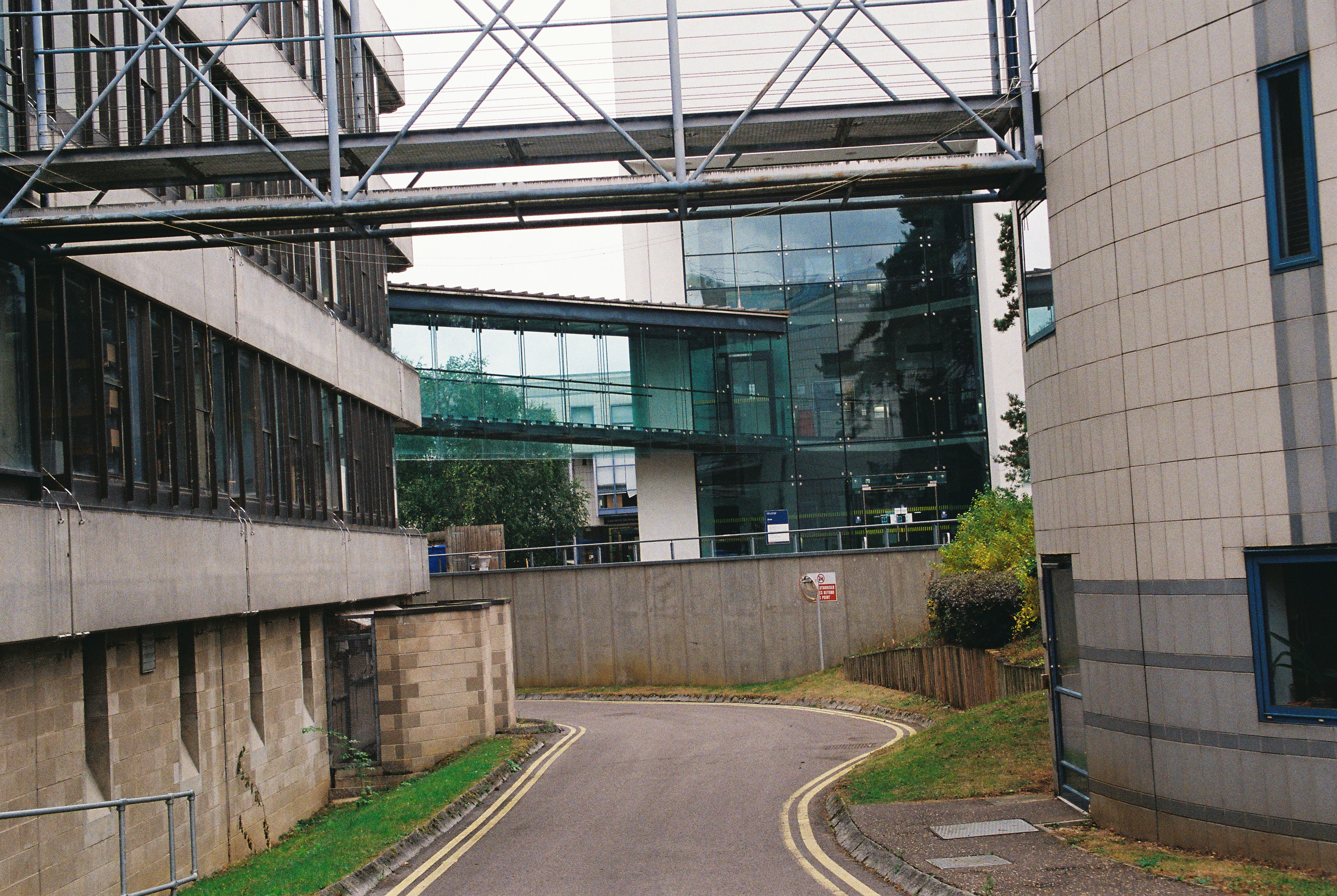 Urban Skywalk Over a Quiet Campus Road