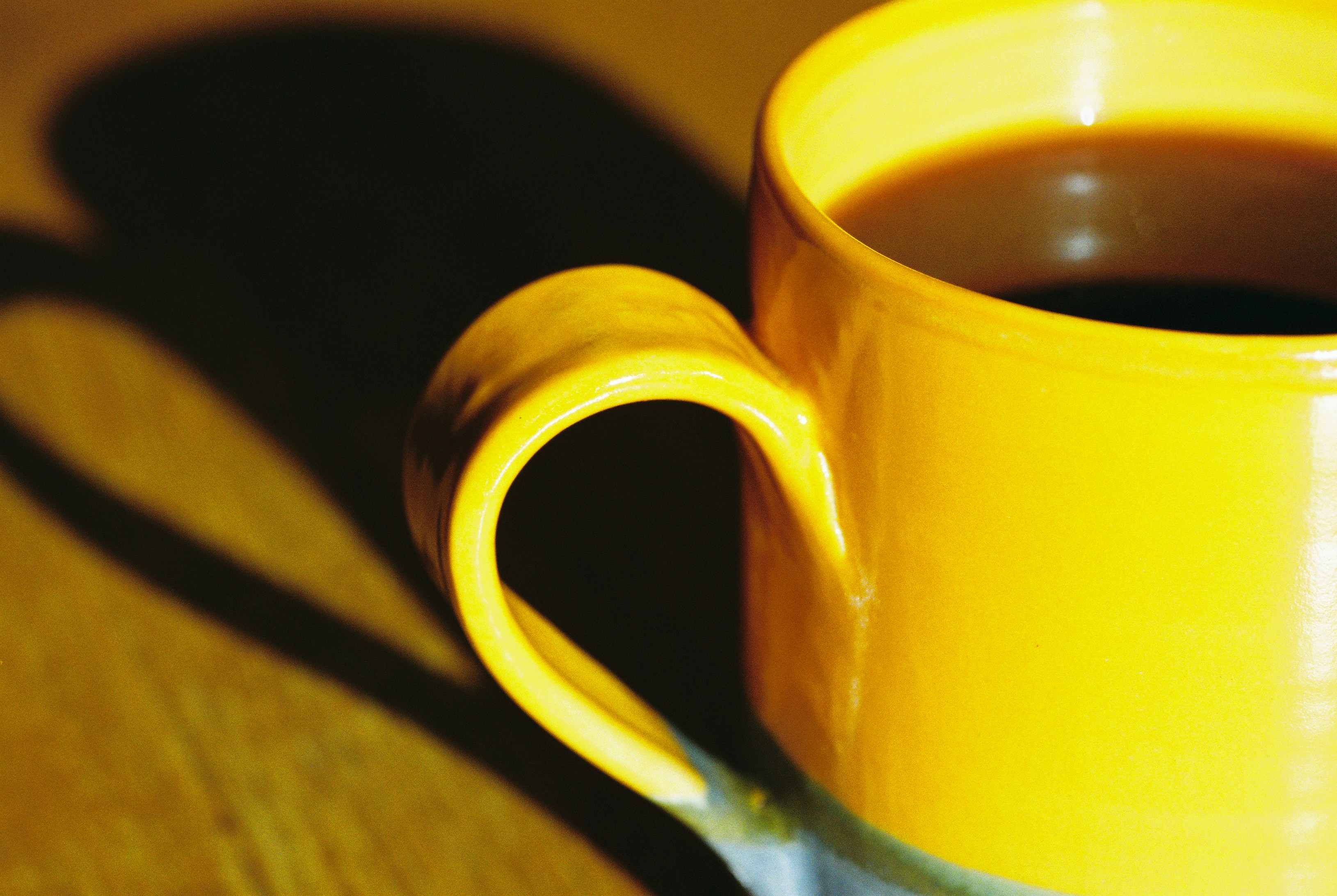 Sunlit Yellow Mug: A Quiet Moment at the Edge of Shadow