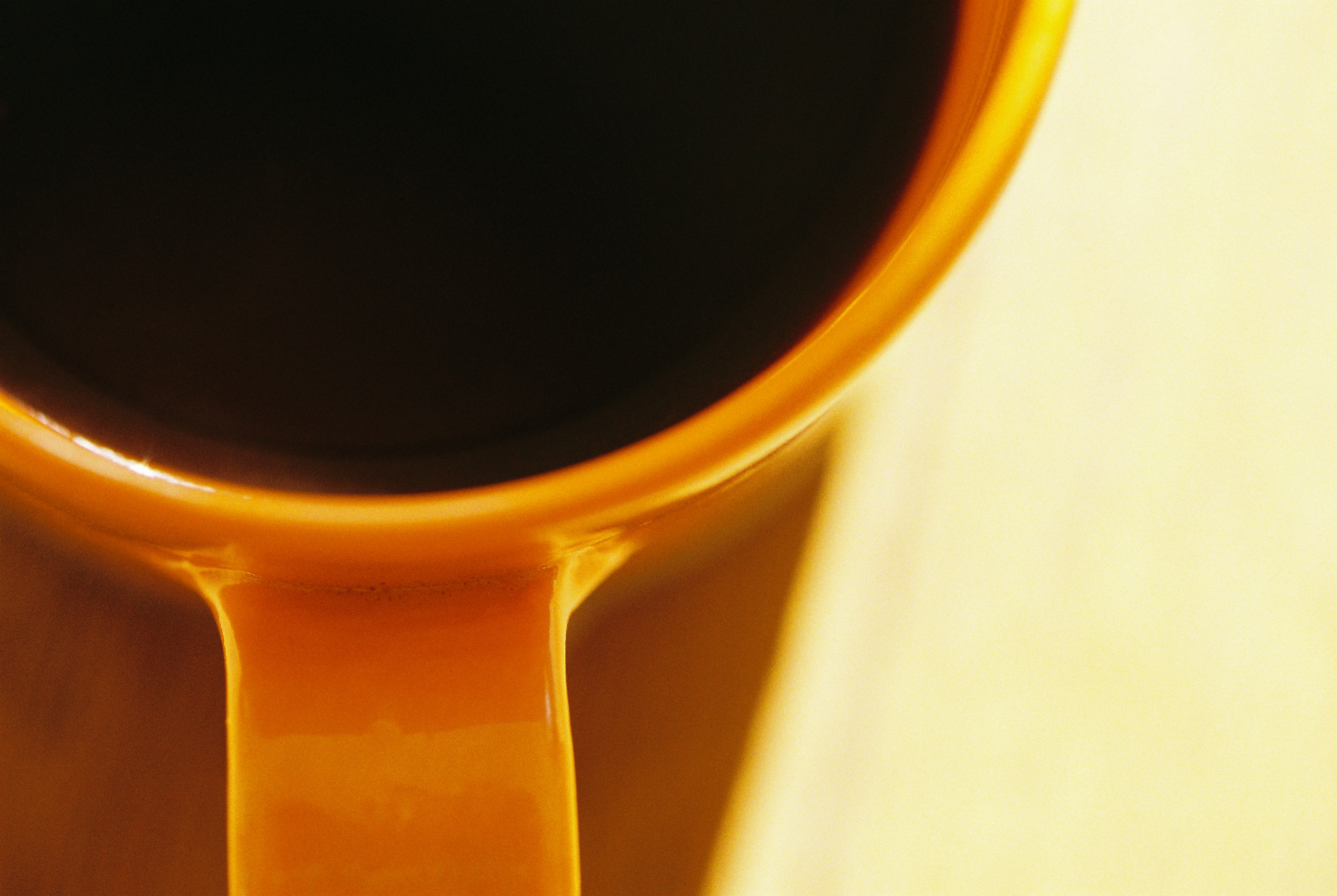 Golden Cup Handle Framing a Dark Sip