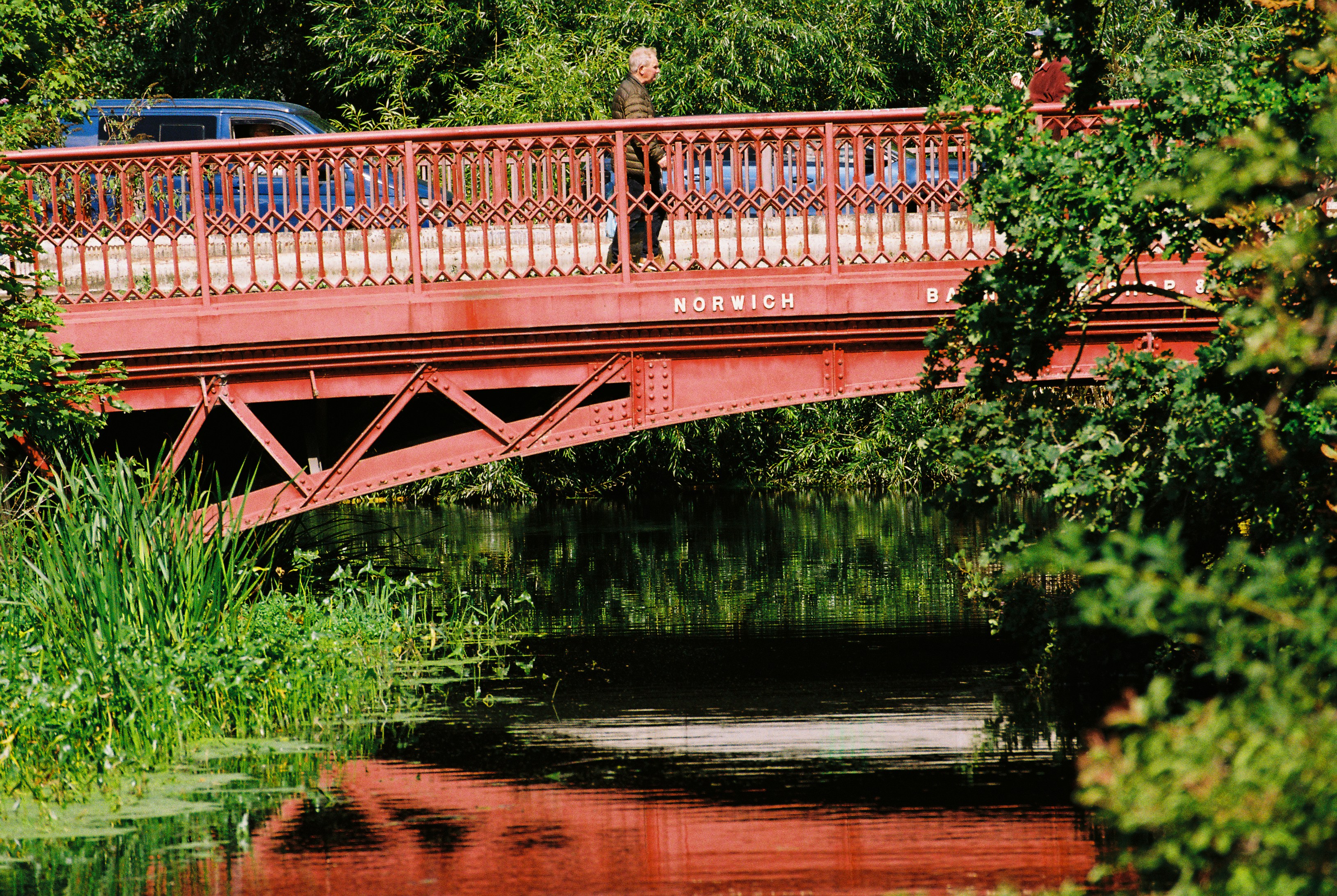 Red Iron Bridge Over Calm River: A Quiet Moment on Norwich Bridge