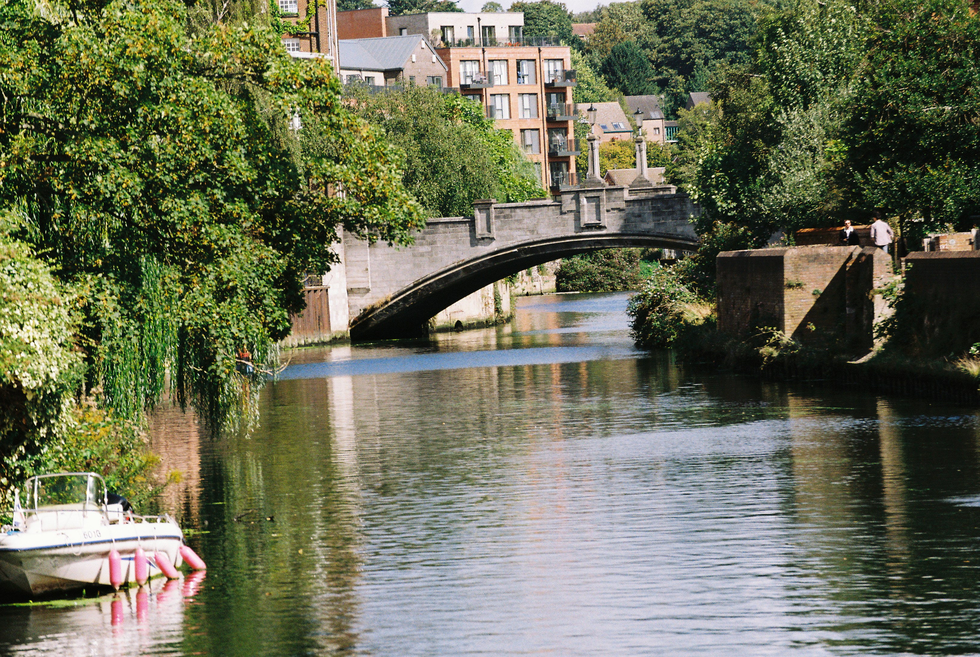Stone Bridge Over Quiet Water: Riverside Scene