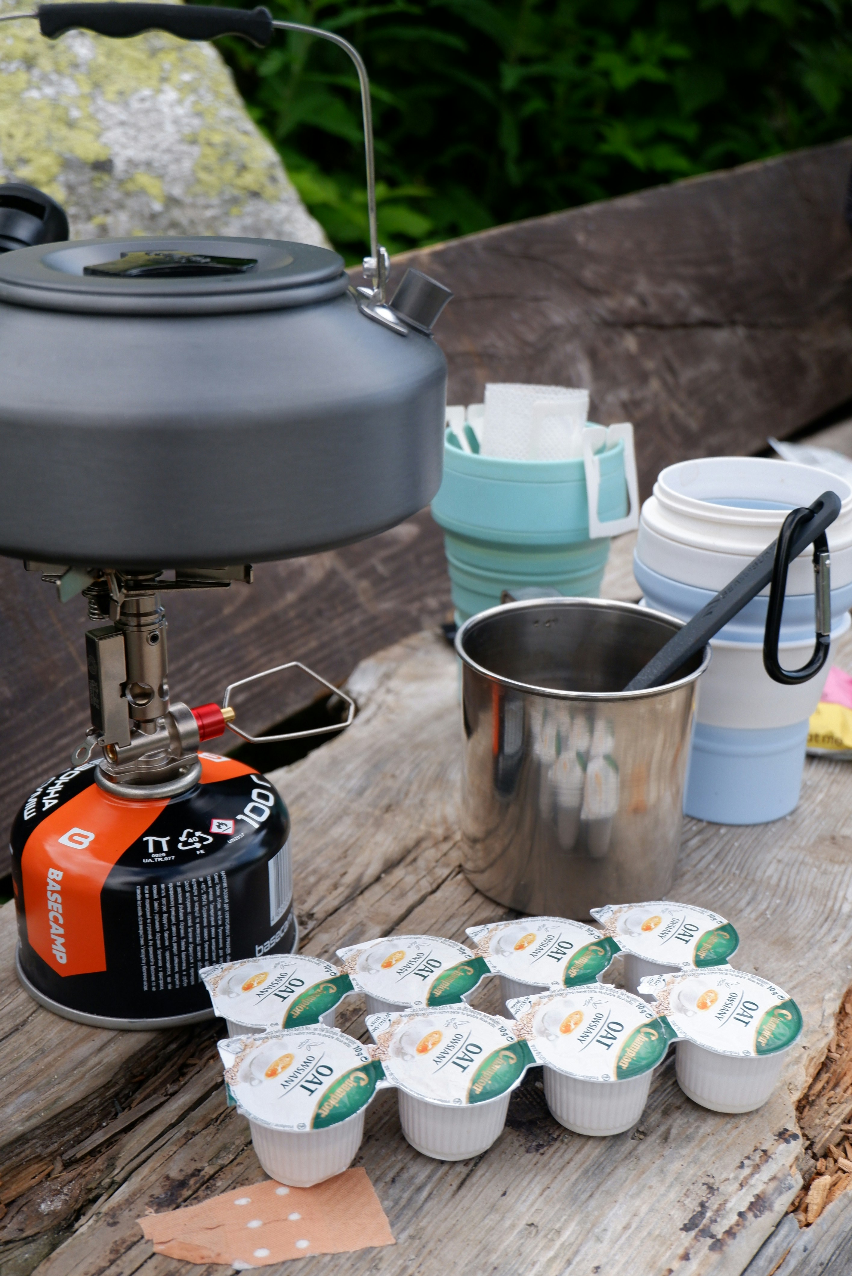 Campfire Companion: A Tiny Brew Station on Weathered Wood
