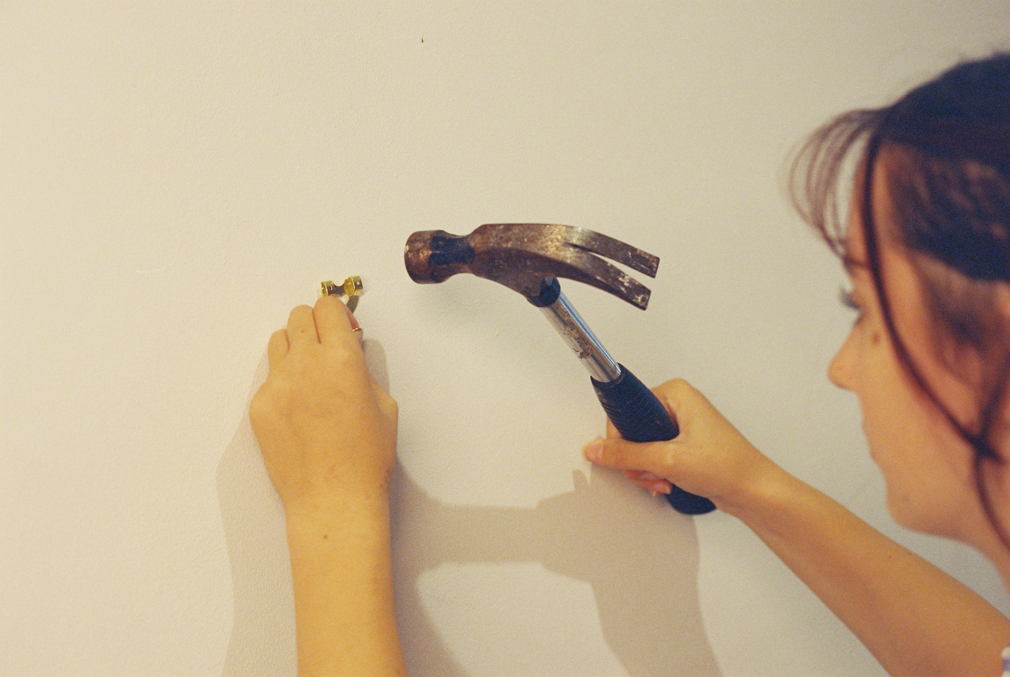 Nail and hammer: a focused moment of wall renovation