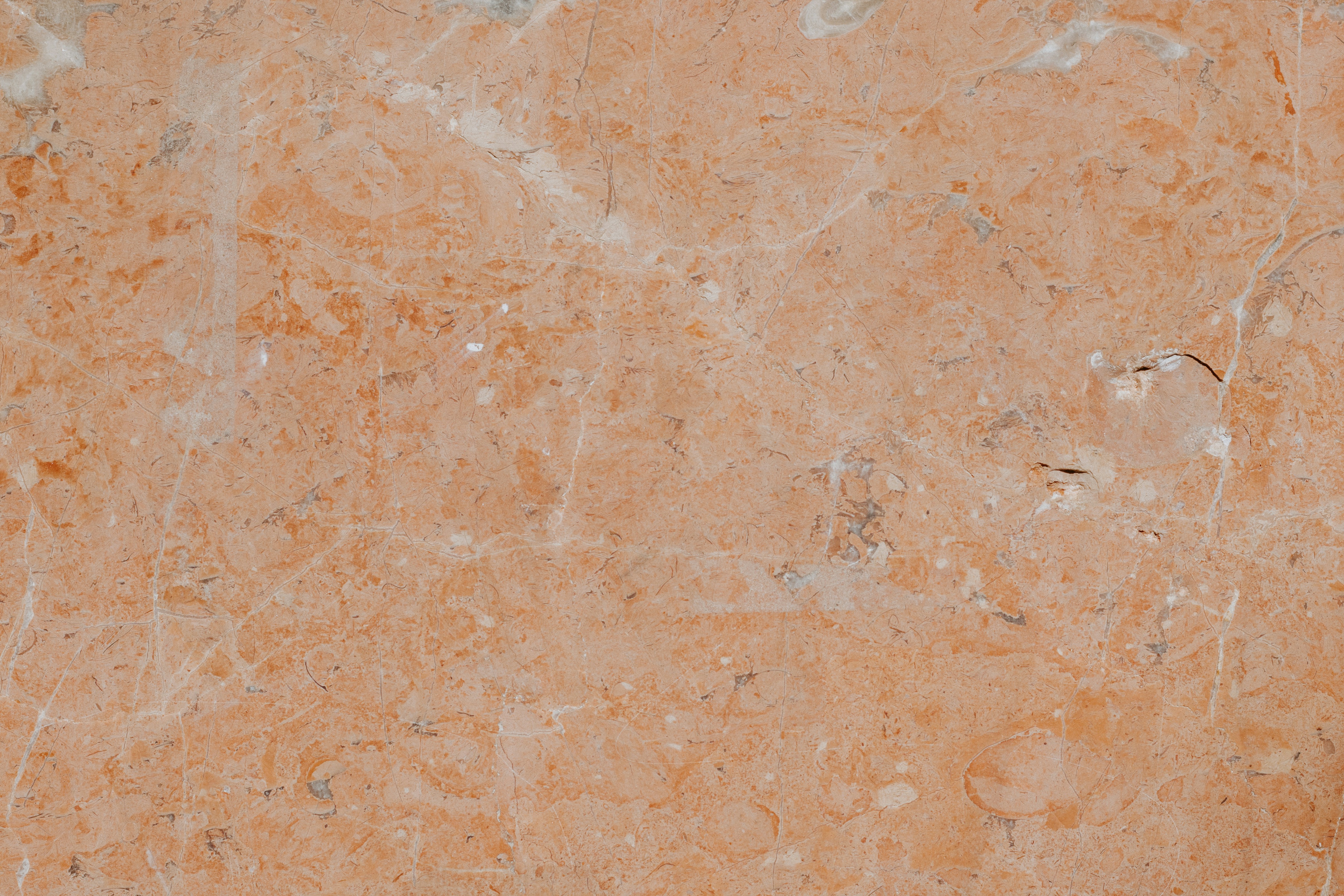Dusty Terracotta Canvas: Subtle Marble of Orange Hues