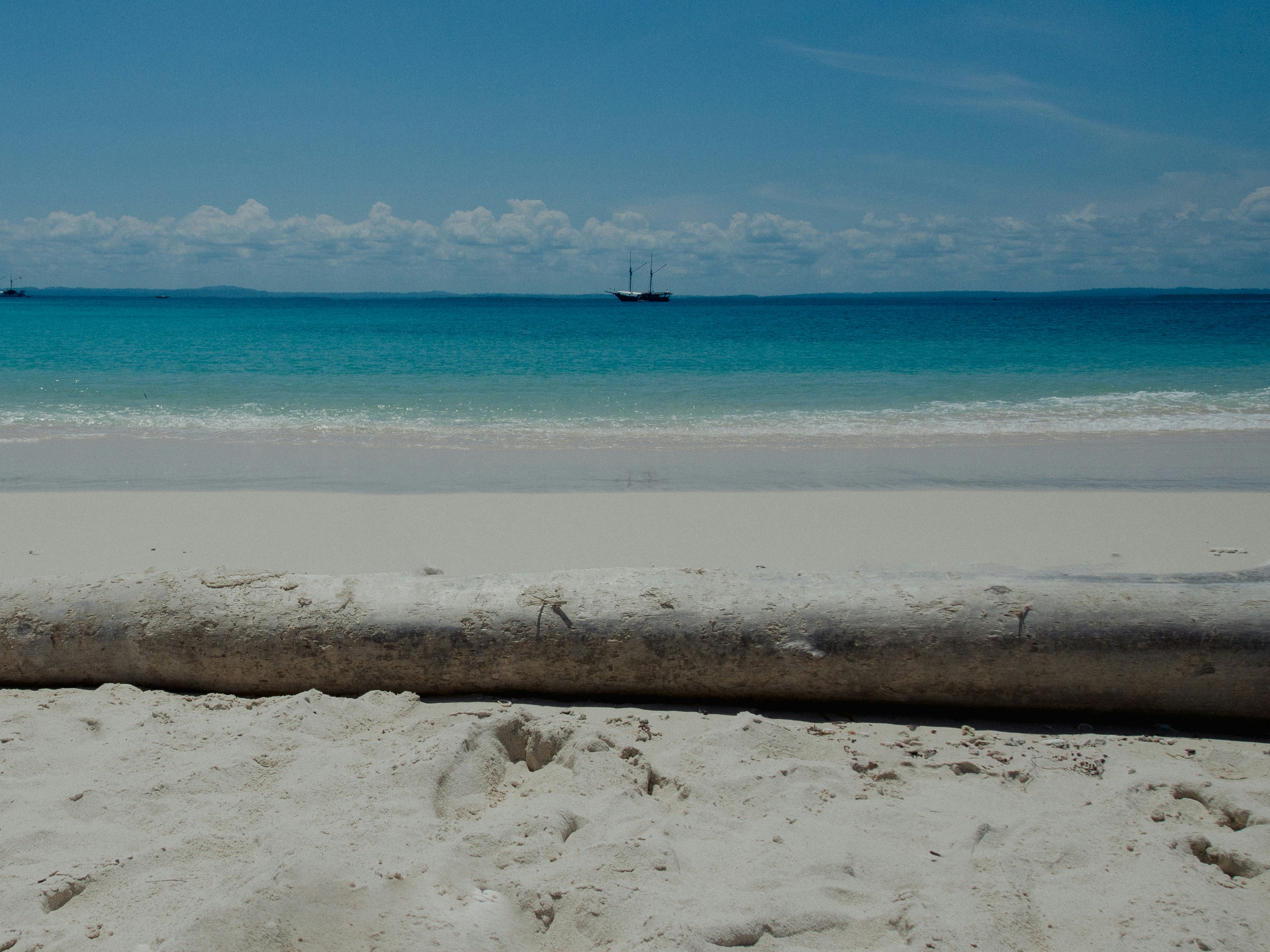 Where the azure of the sky melts into the deep indigo of the infinite ocean.