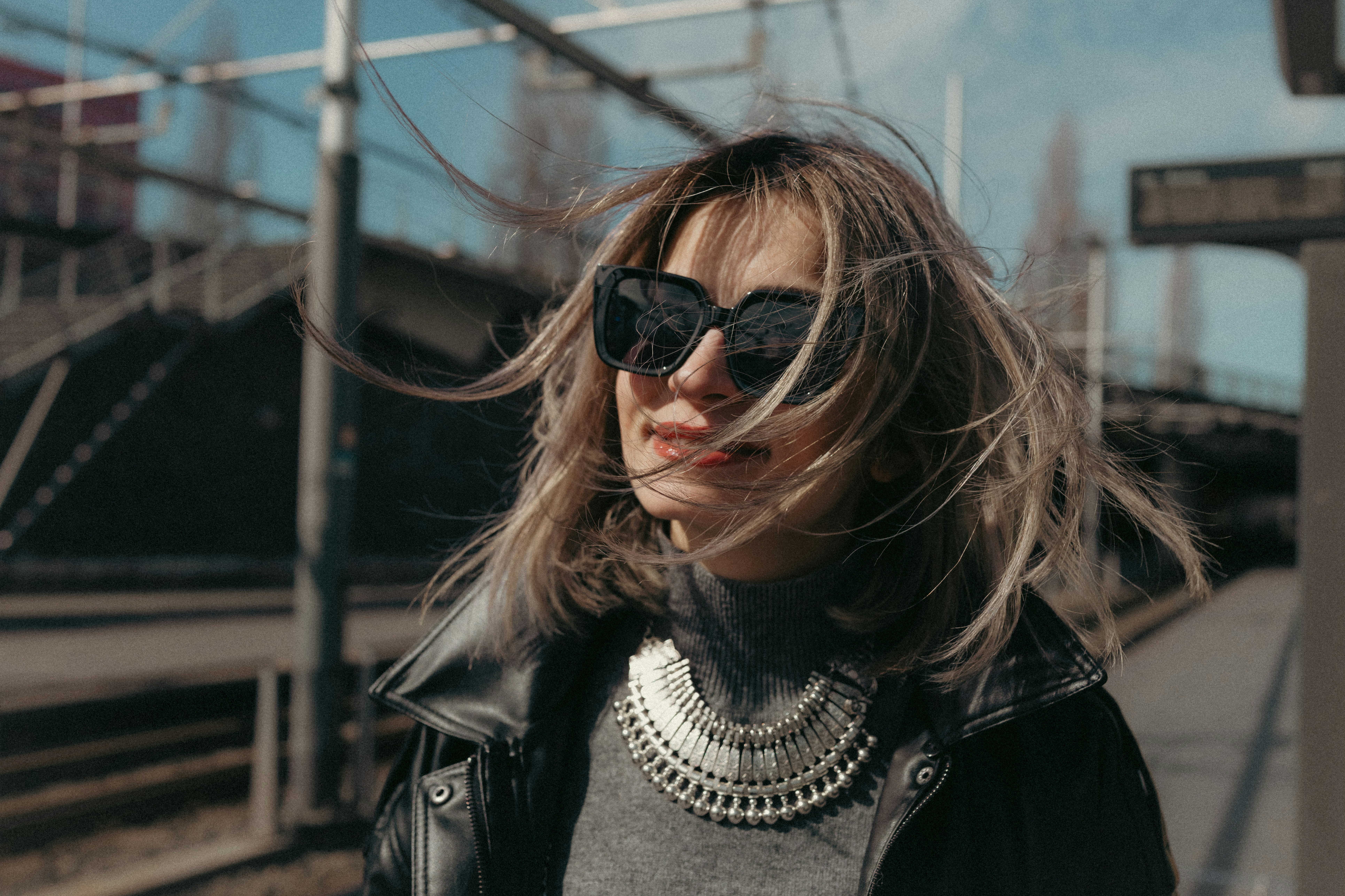 Wind in the Frames: Chic Portrait at a City Platform