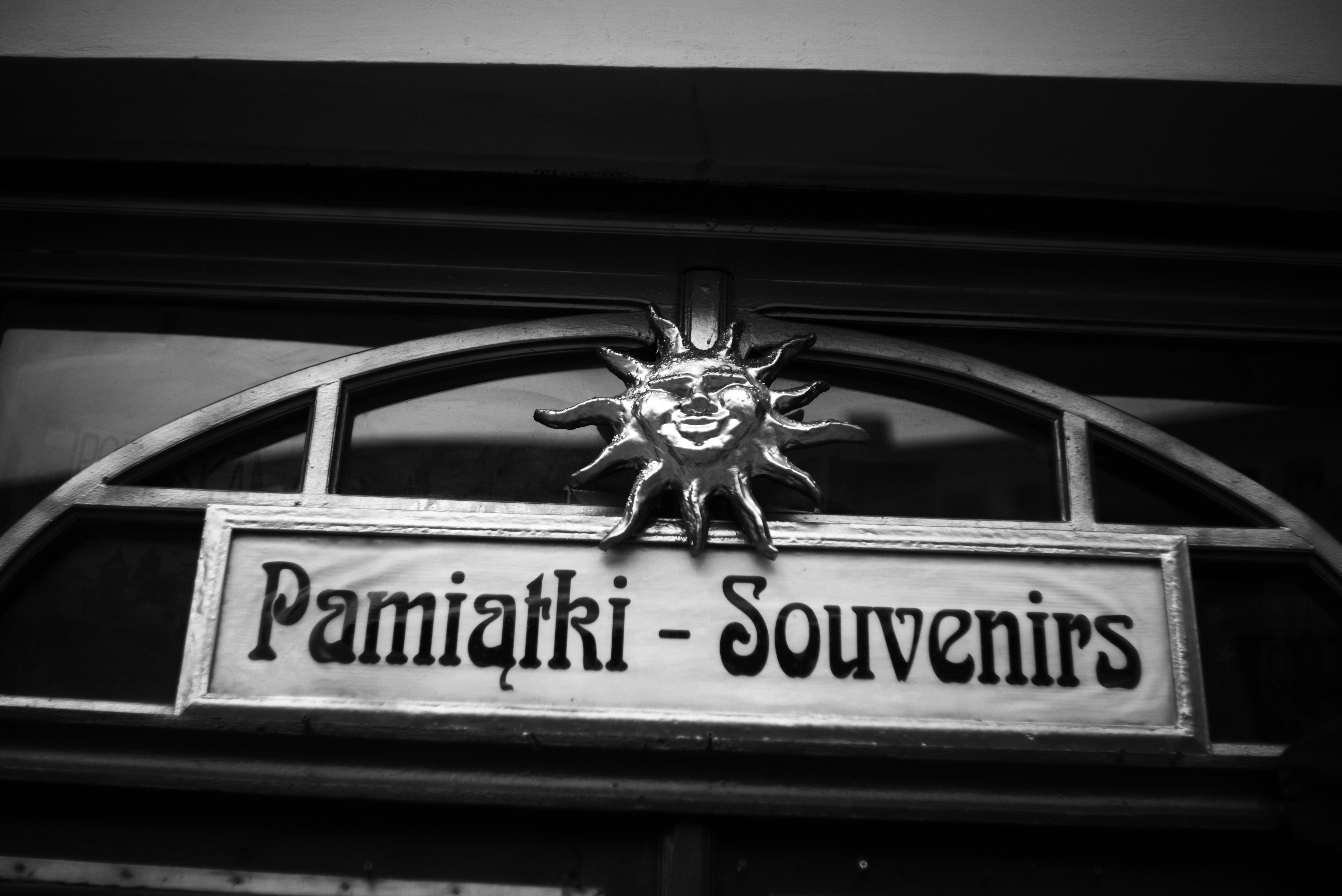Sunburst Emblem Over a Vintage Sign