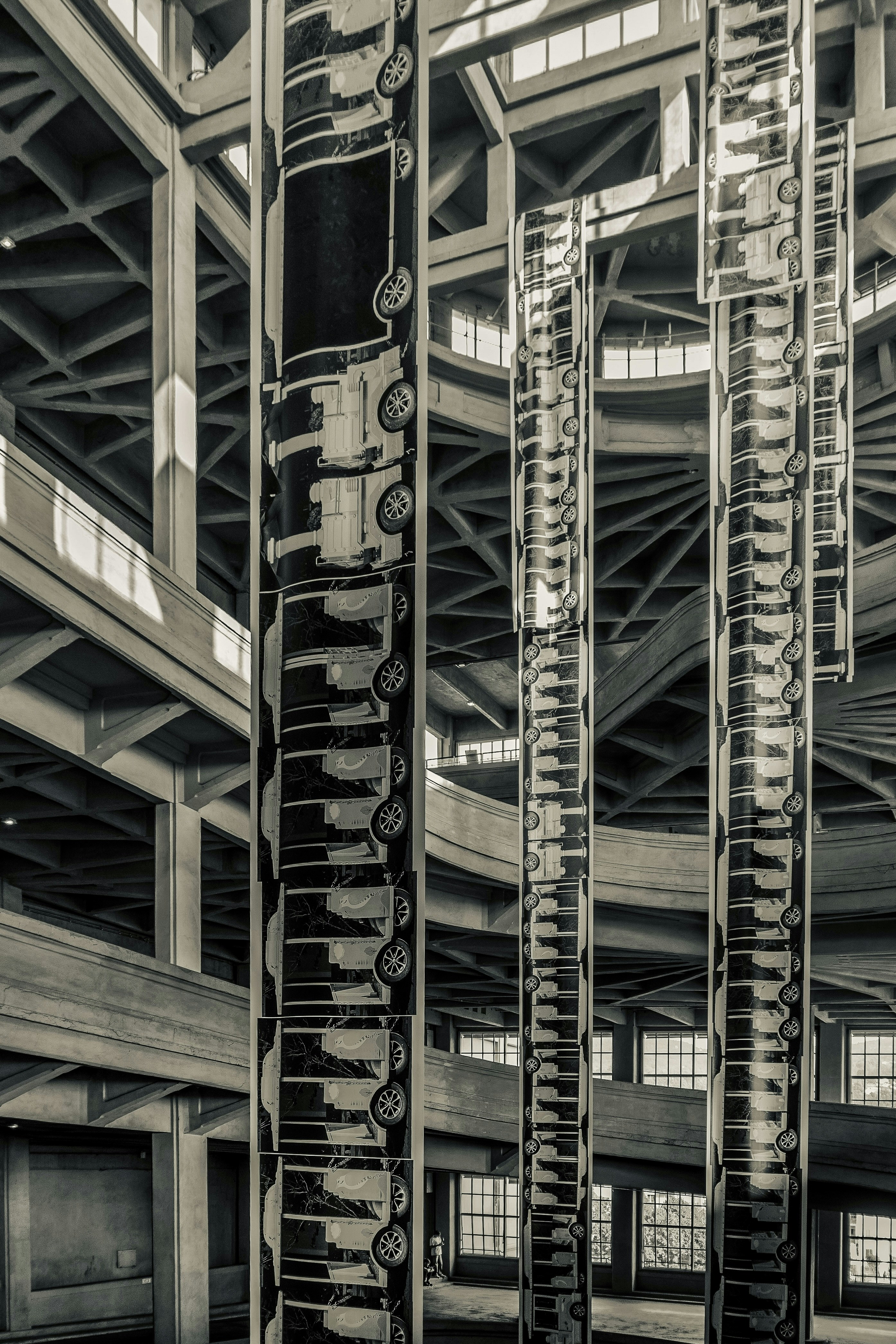 Industrial Echoes: Rows of Cars Adrift in a Concrete Atrium